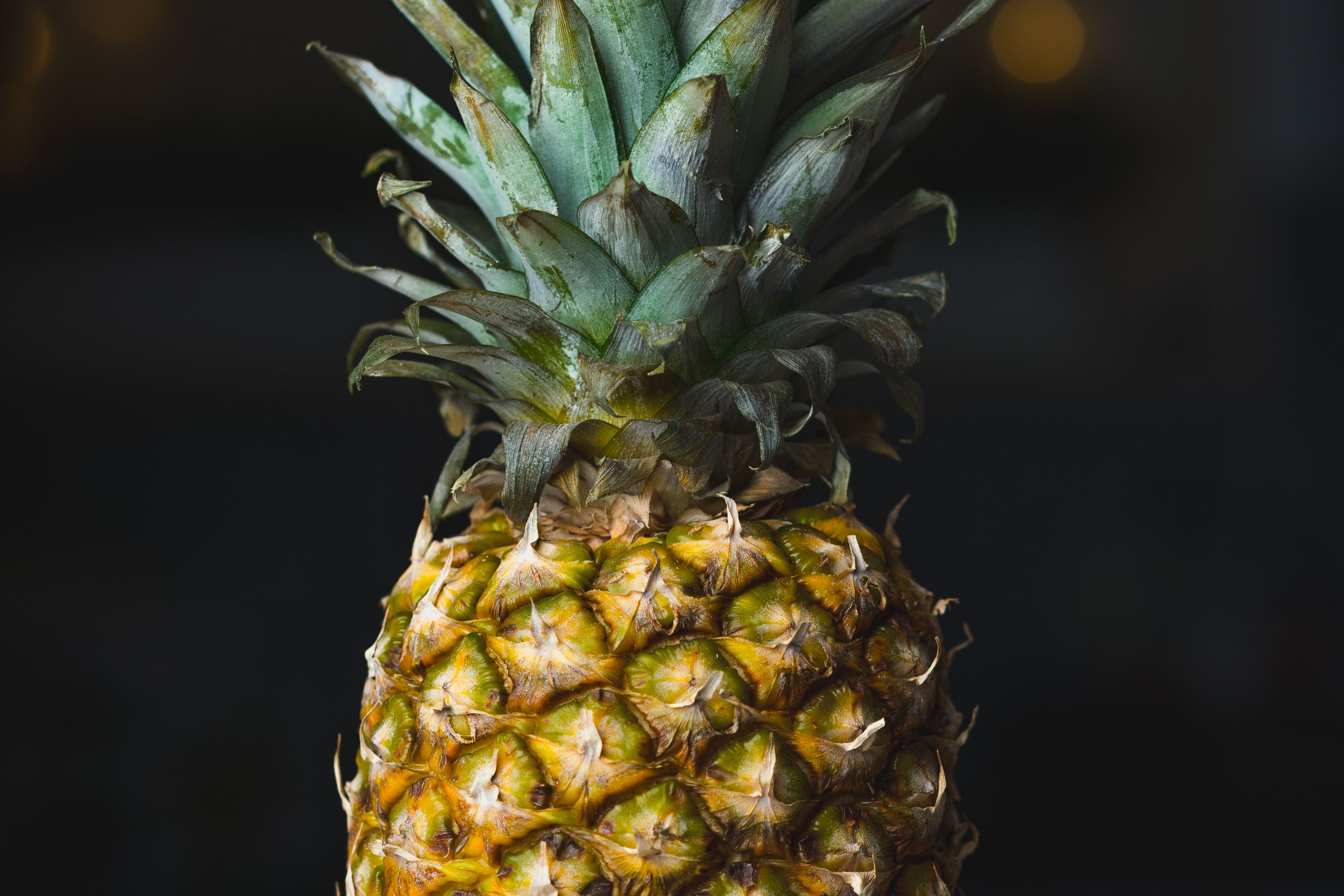 Close-up Photo of Pineapple Crown Against Pink Background · Free Stock ...