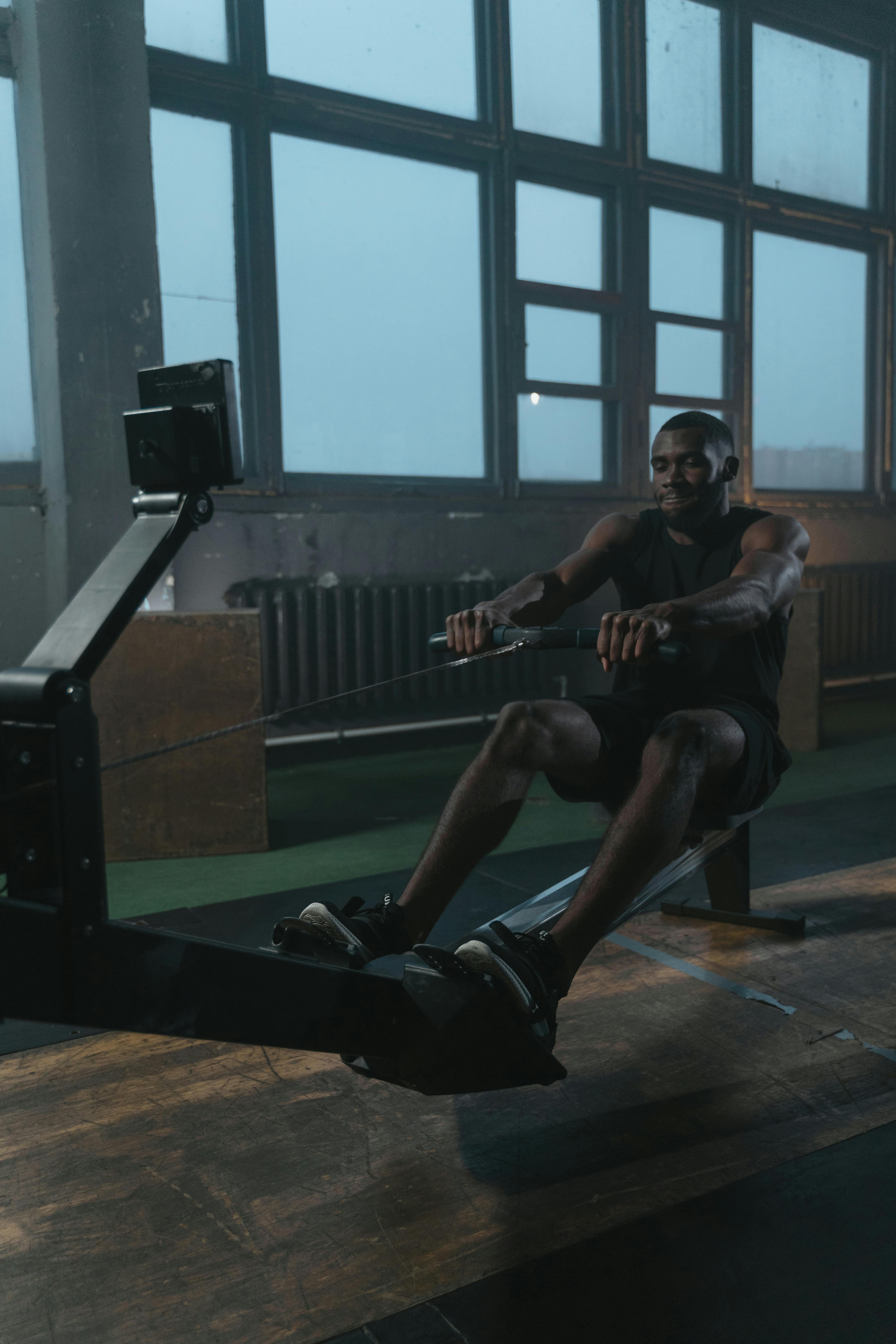 A Man Using a Rowing Machine · Free Stock Photo