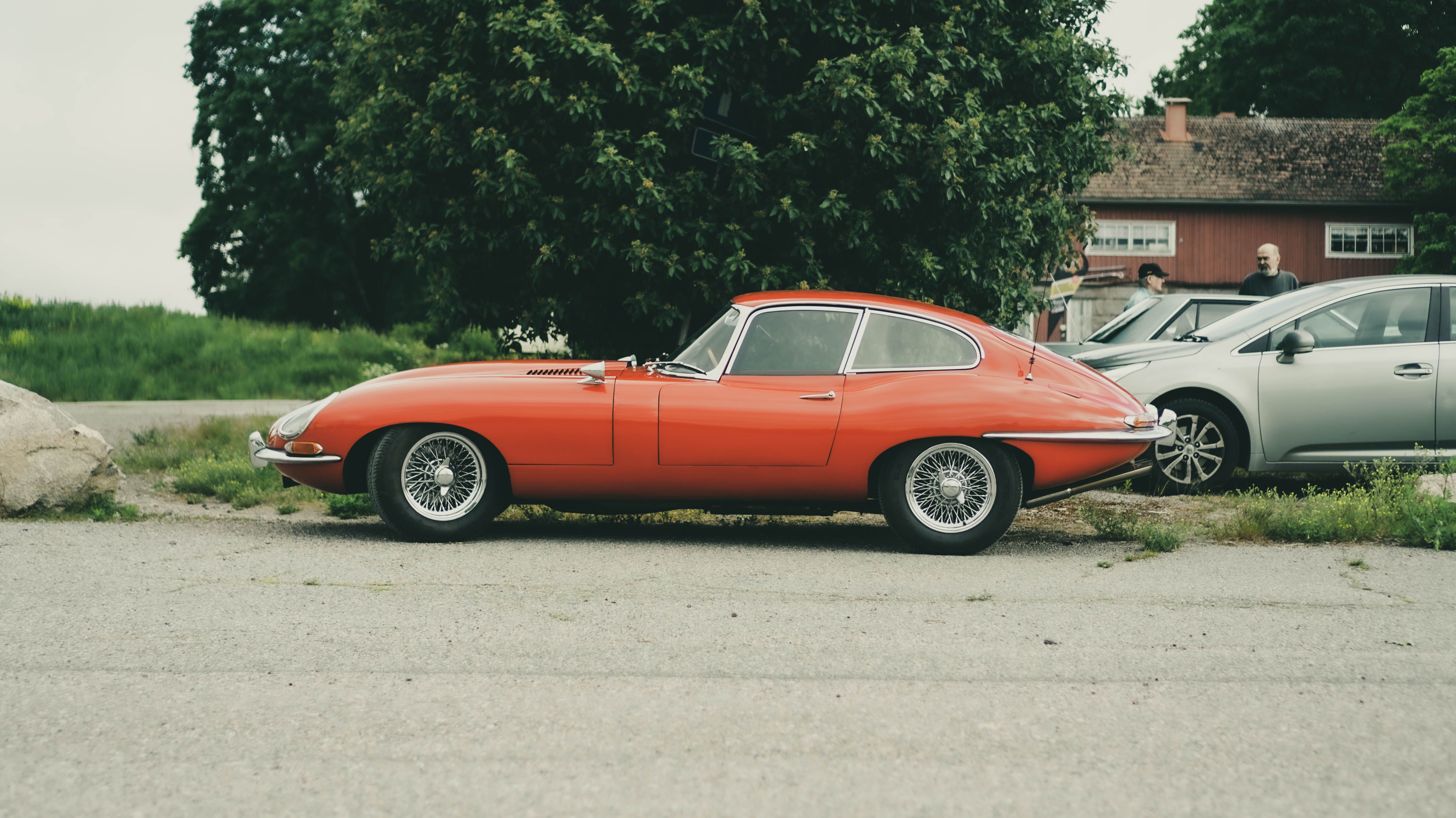 A Red Car Parked on the Road · Free Stock Photo