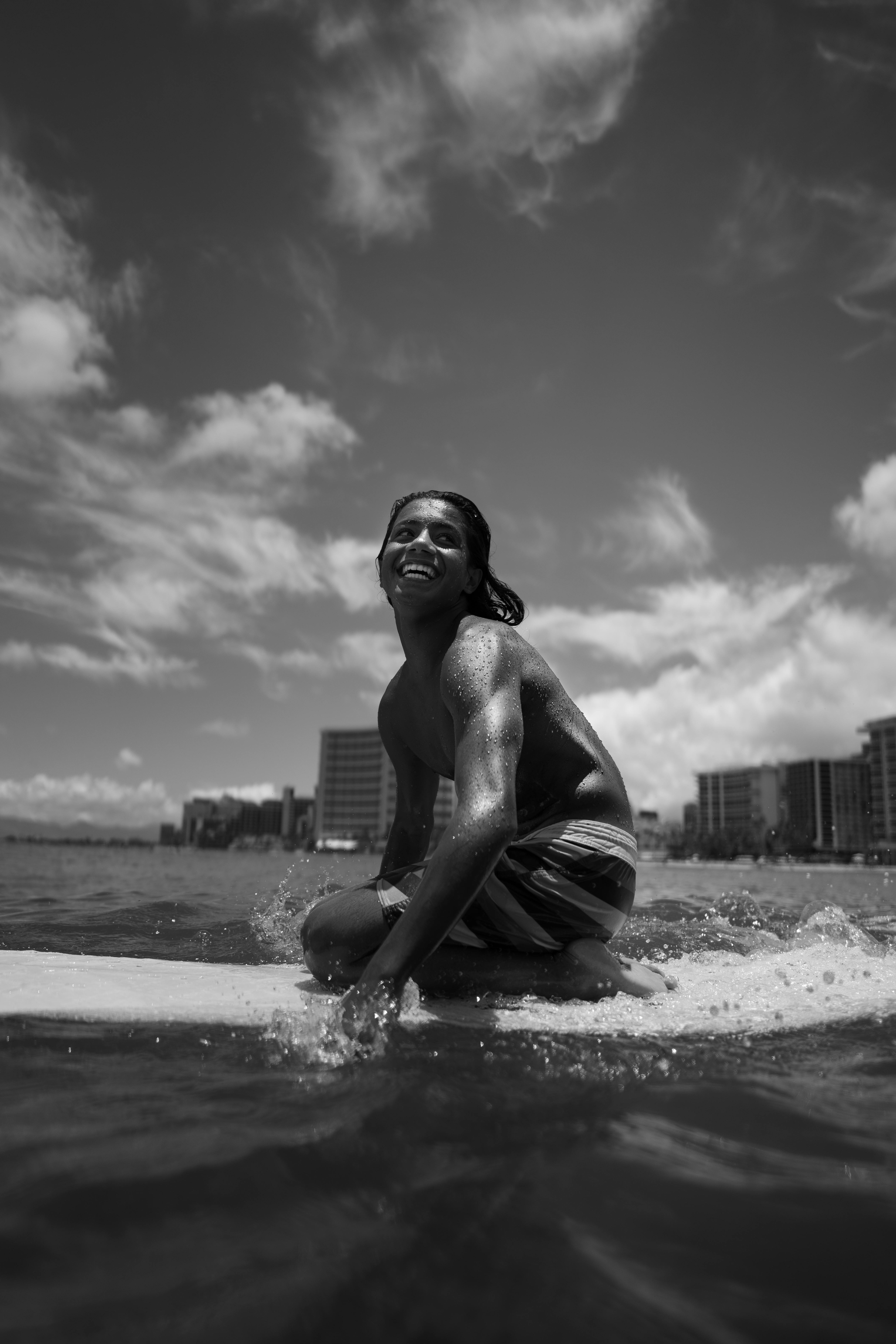 Black man in swimwear surfing in water · Free Stock Photo