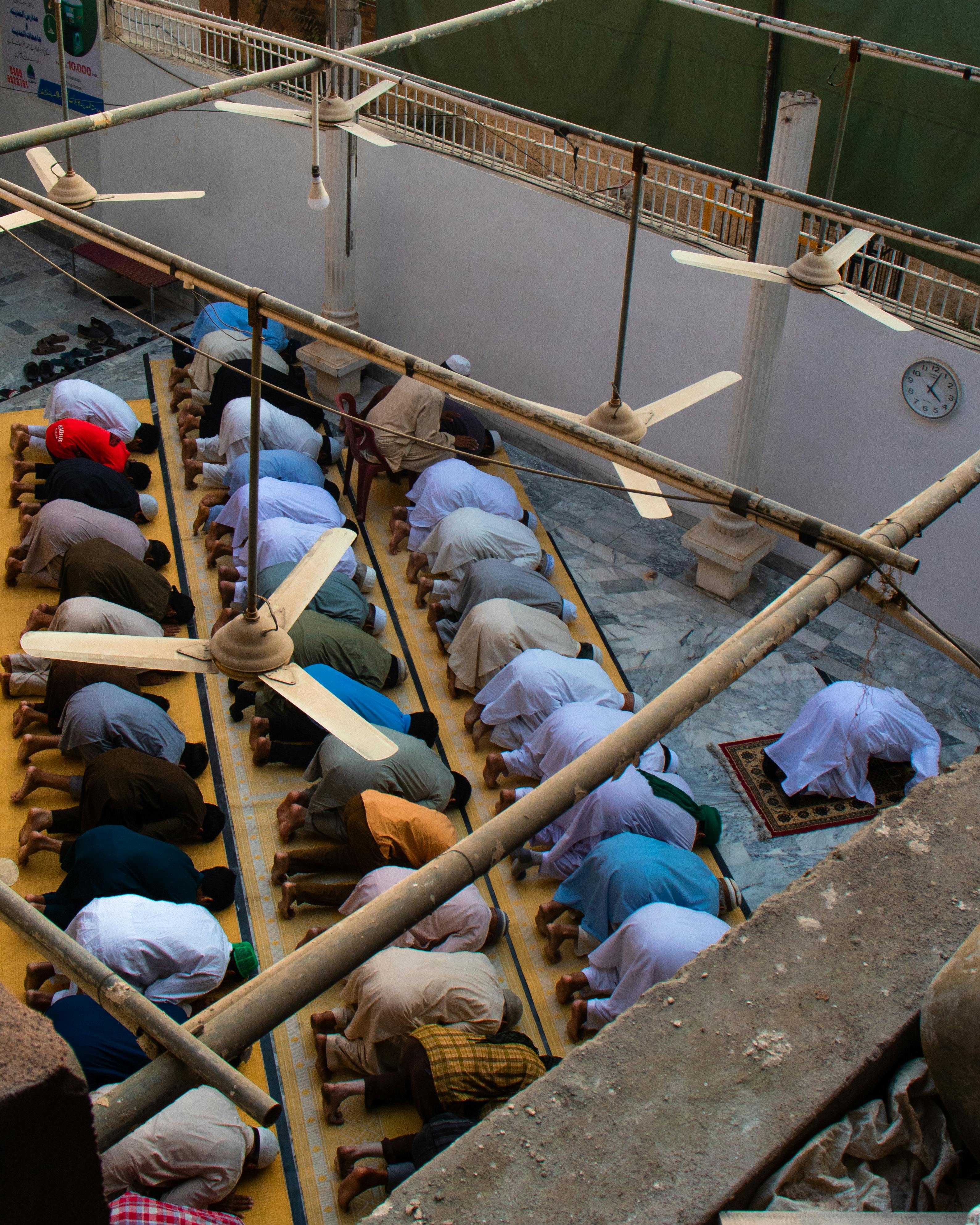 Man Praying Inside a Mosque · Free Stock Photo