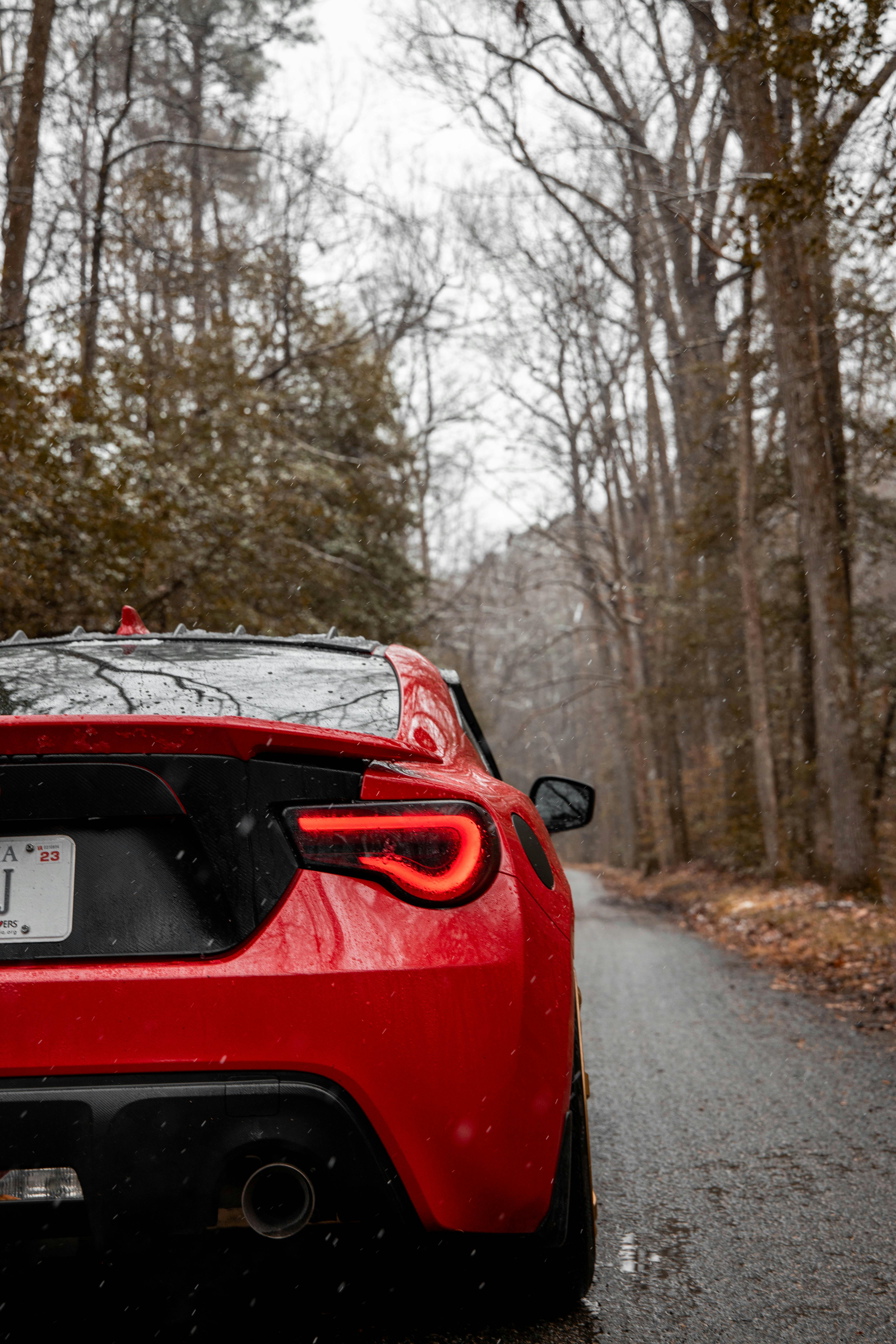 A Back View of a Red Car · Free Stock Photo