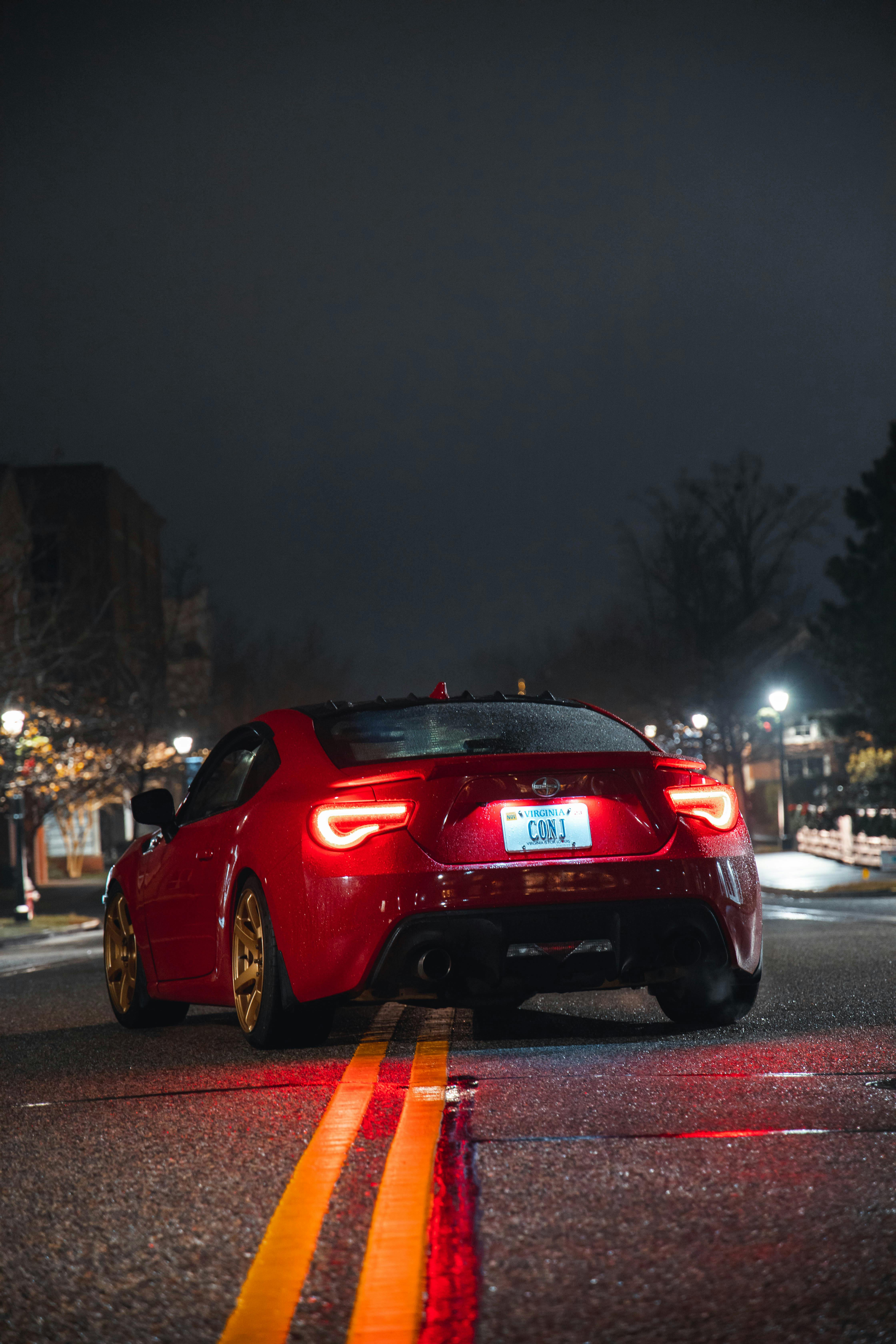 A Back View of a Red Car · Free Stock Photo