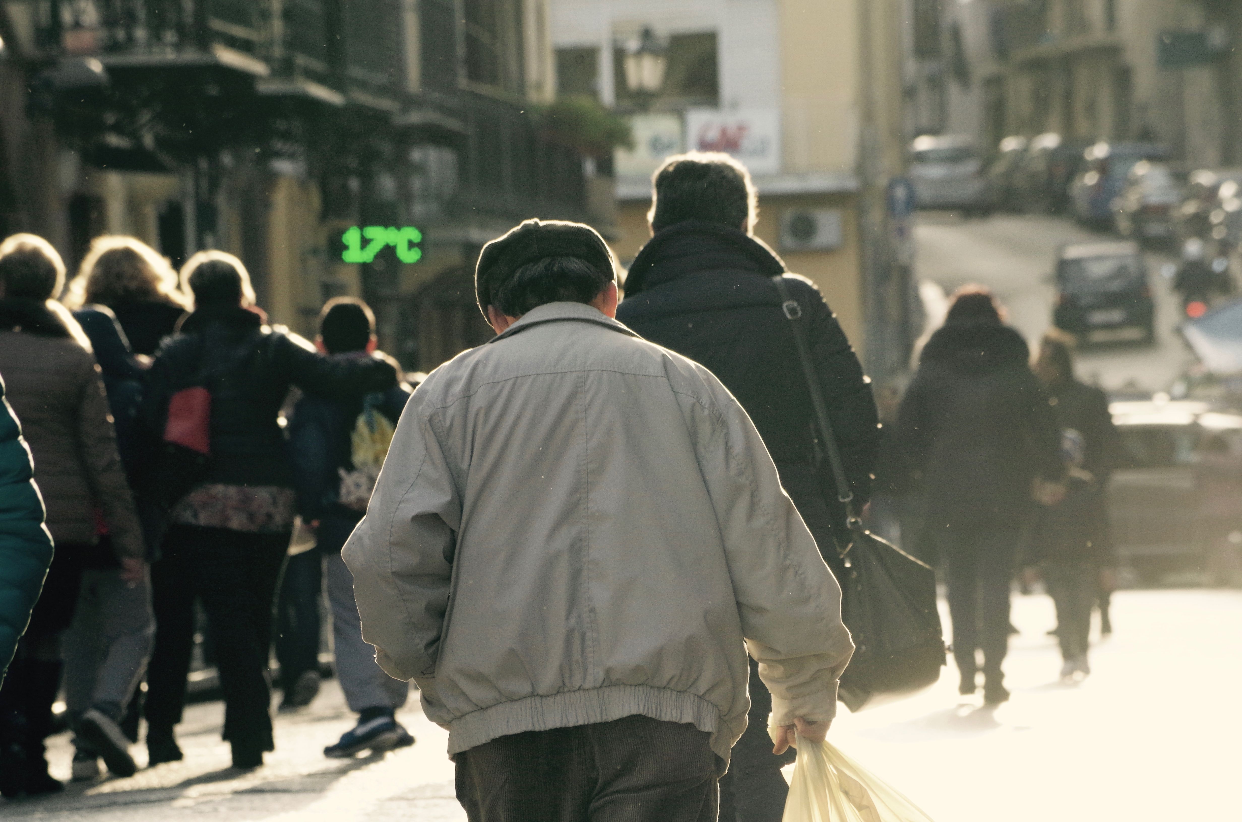 Back View of People Walking in the Street · Free Stock Photo