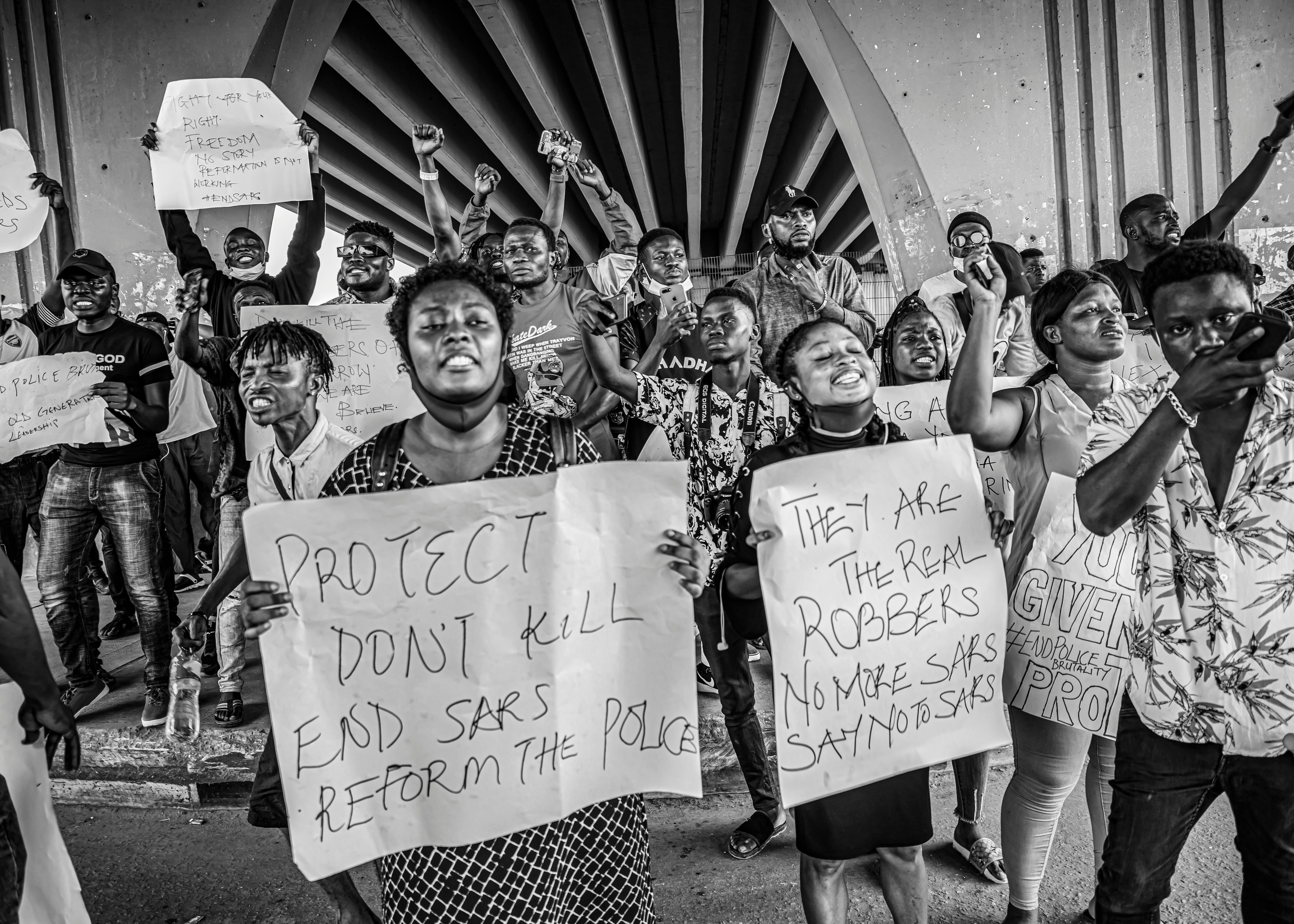 People Holding Banners while Protesting on the Street · Free Stock Photo