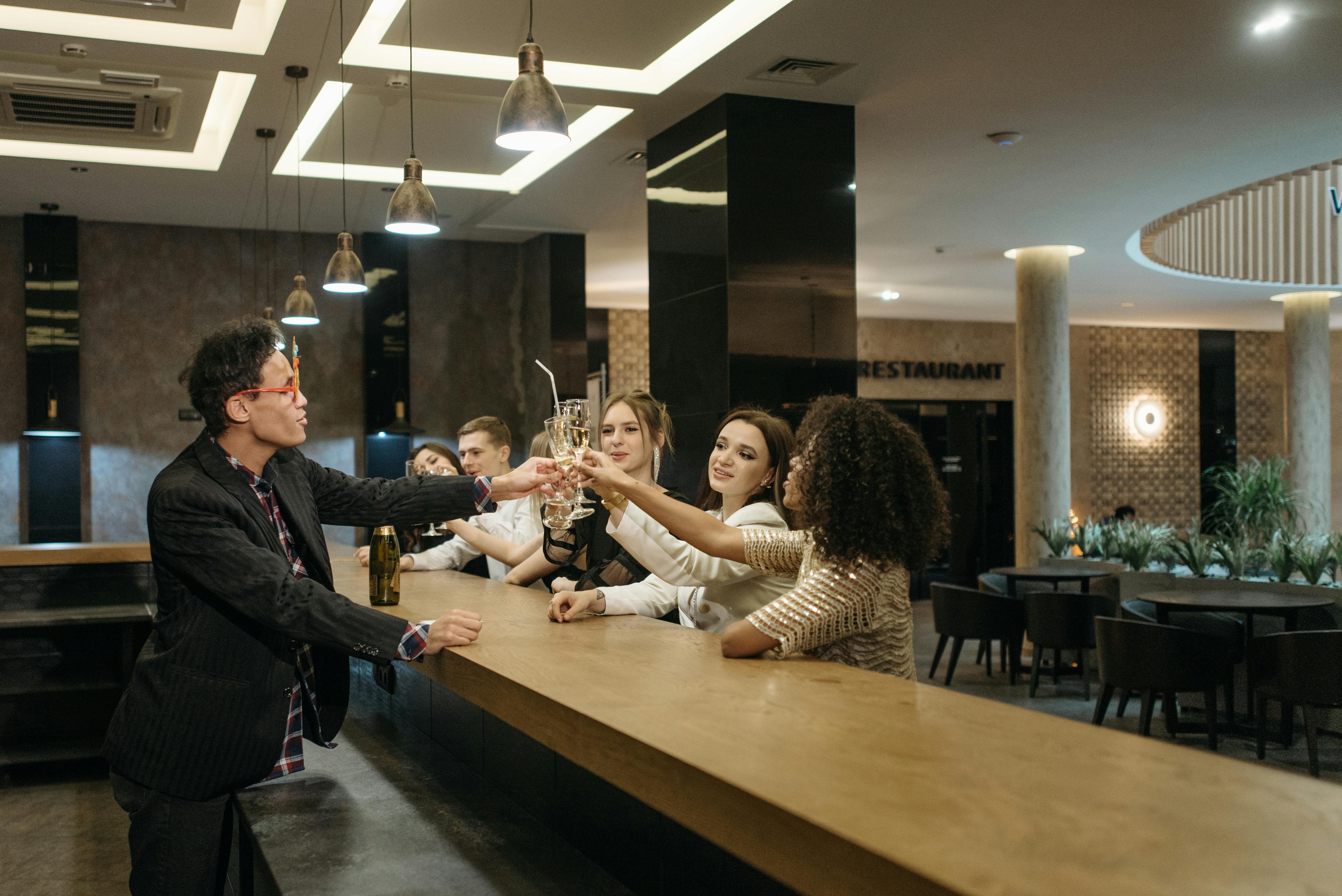 A Team Having a Celebration at a Bar · Free Stock Photo
