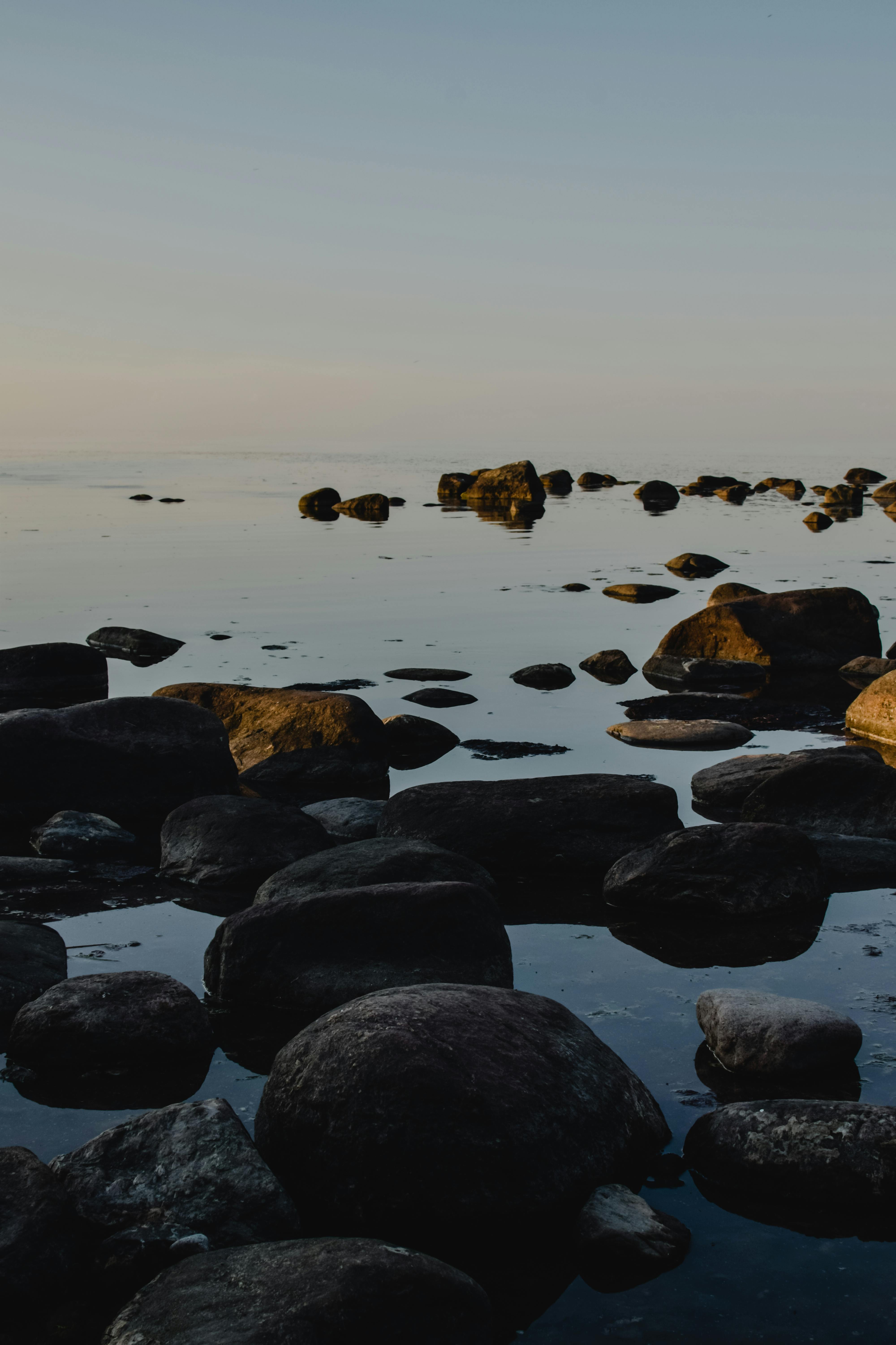Black Rocks on Sea Shore · Free Stock Photo