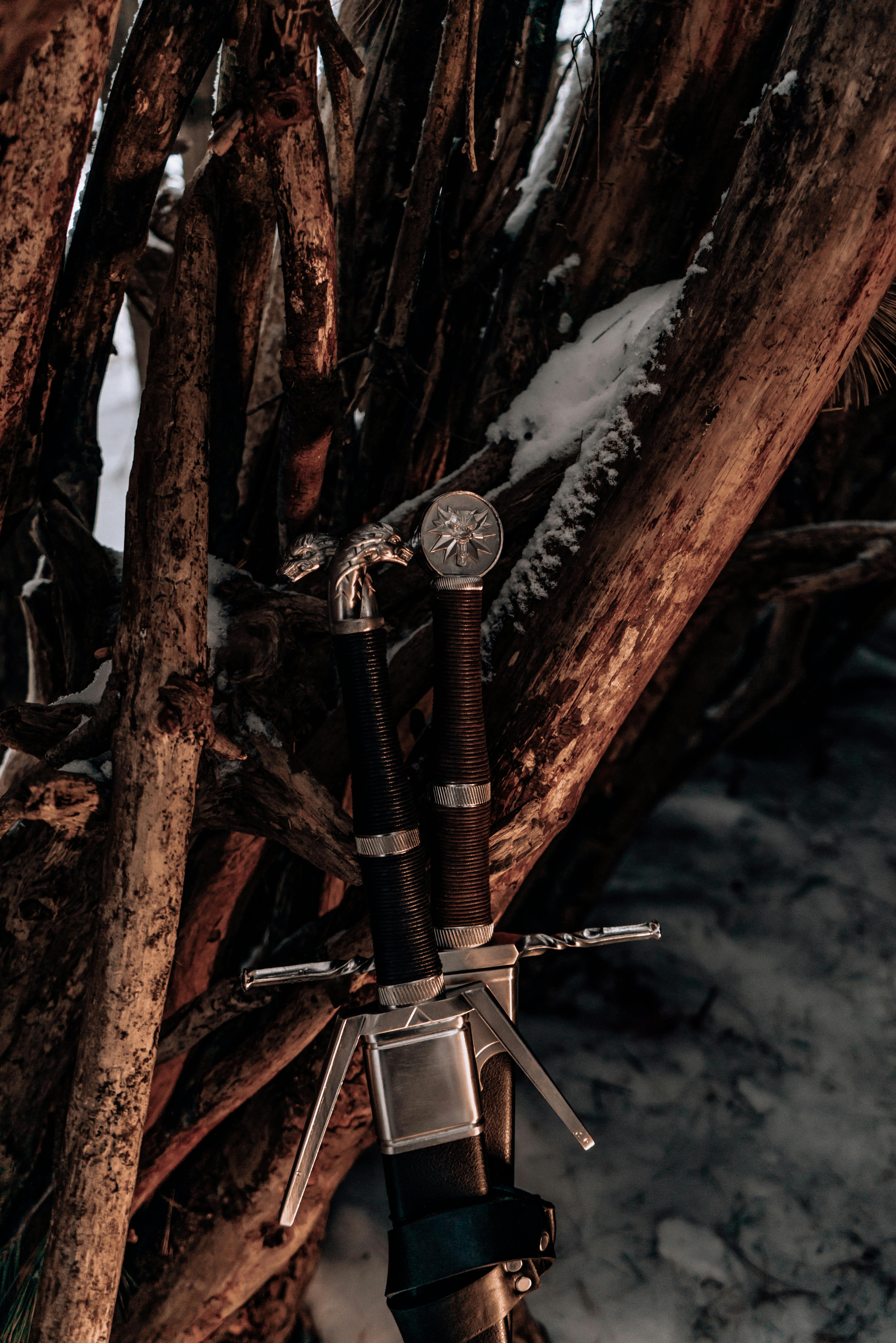 Swords Leaning on Wood · Free Stock Photo