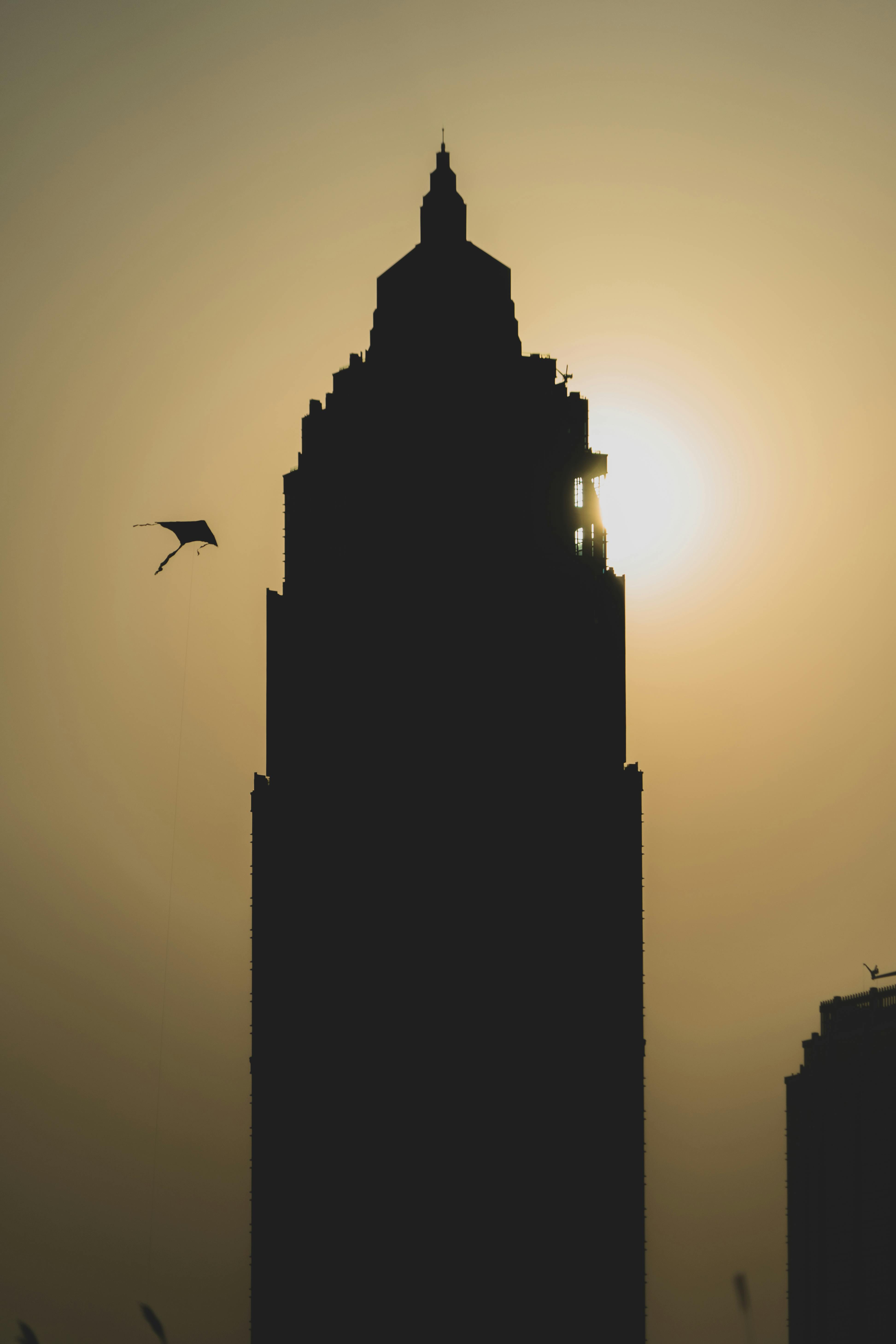 Silhouette of a High-Rise Building during Sunset · Free Stock Photo