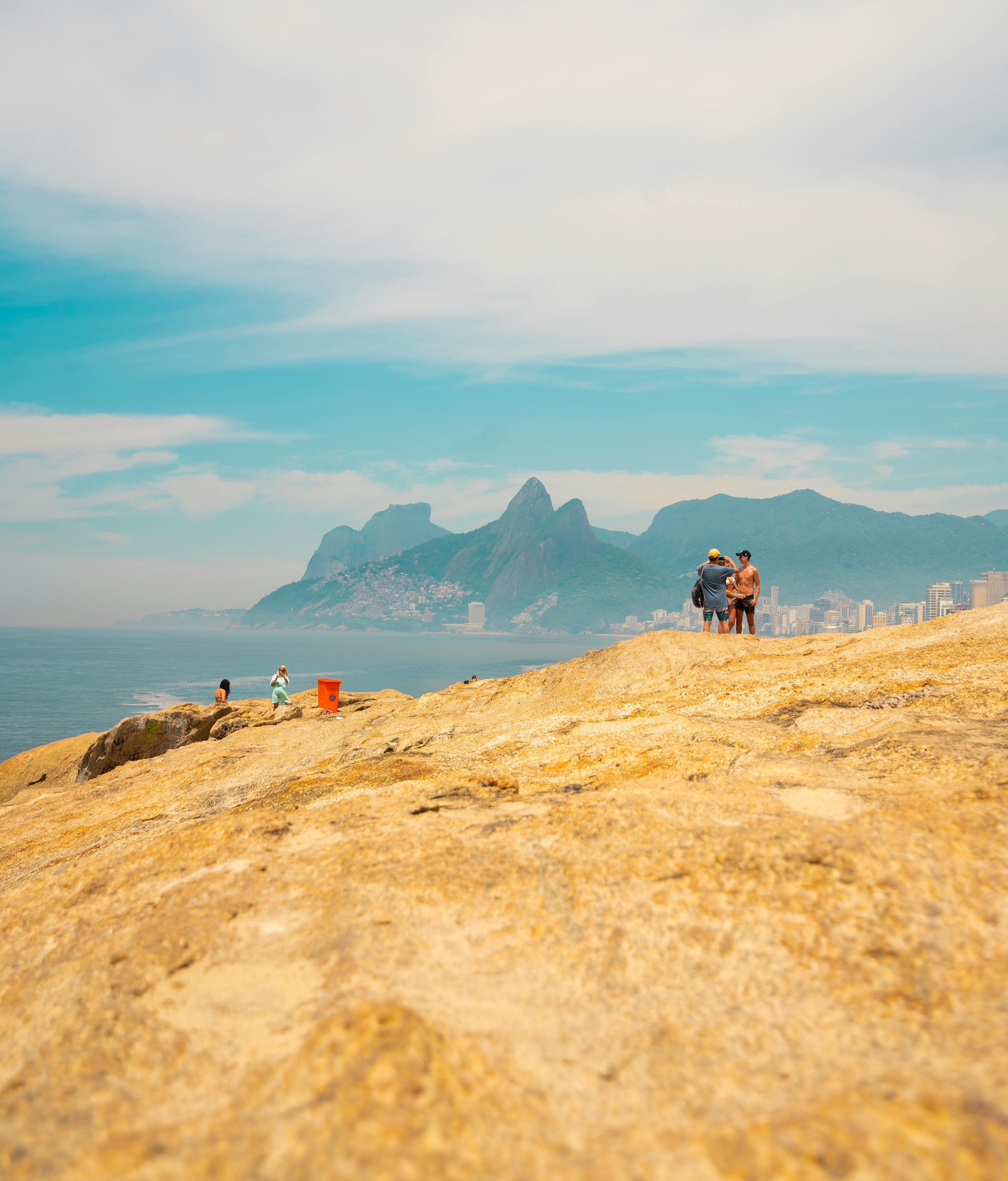 A Man Standing on the Cliff Overlooking a Beautiful Scenery of Islands ...