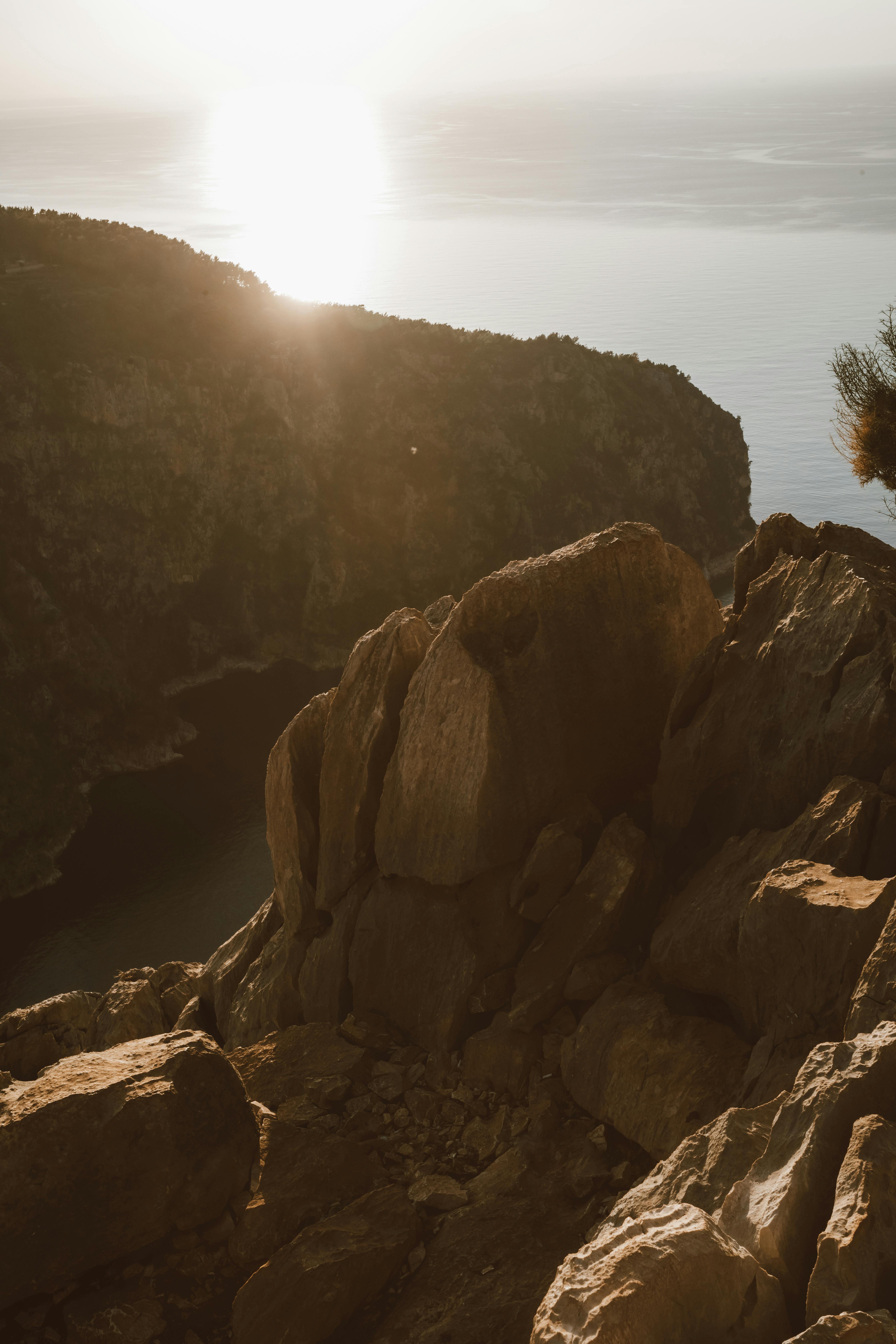 A Big Rock Formation Near a Body of Water · Free Stock Photo