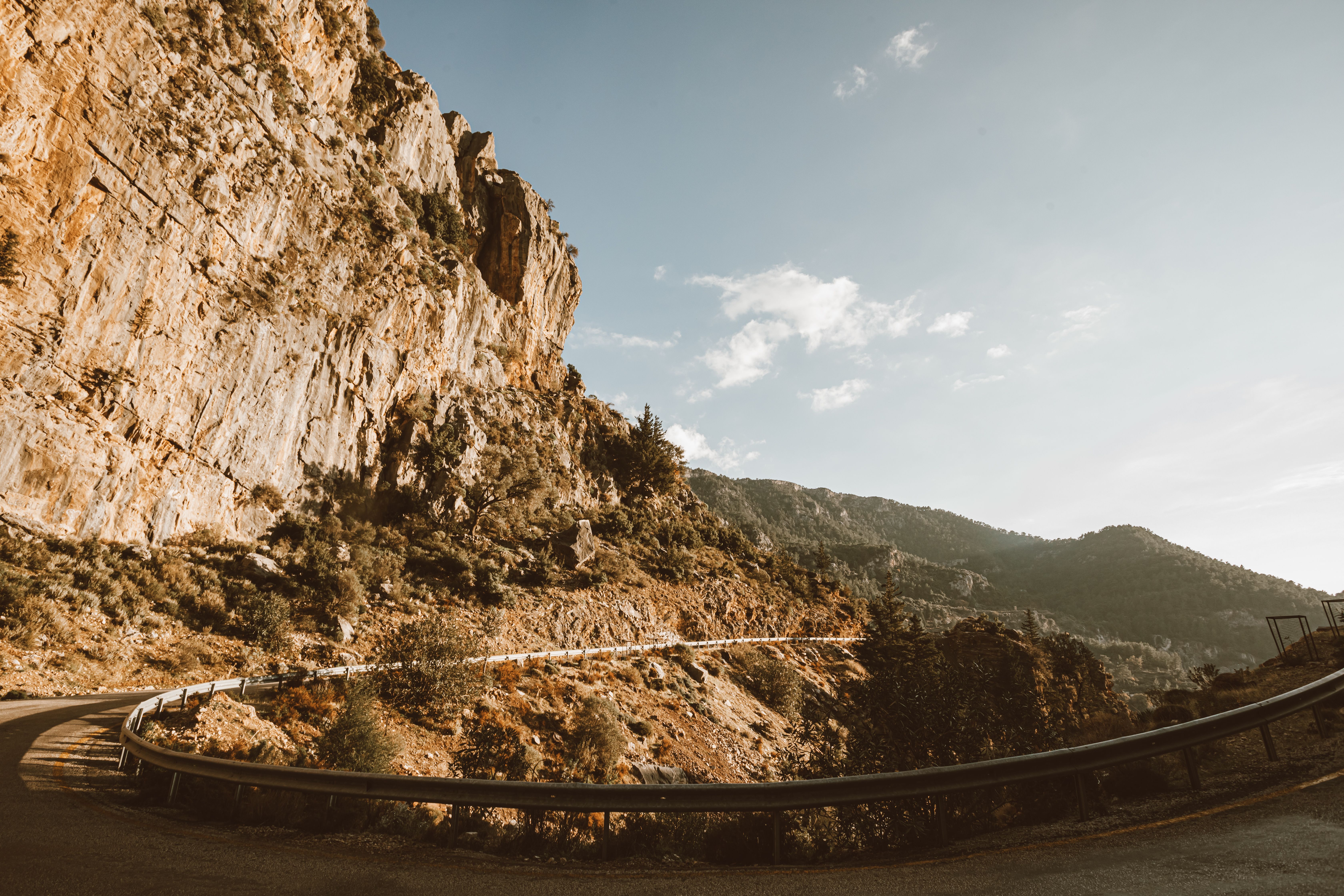 A Scenic View of a Mountainside Road · Free Stock Photo
