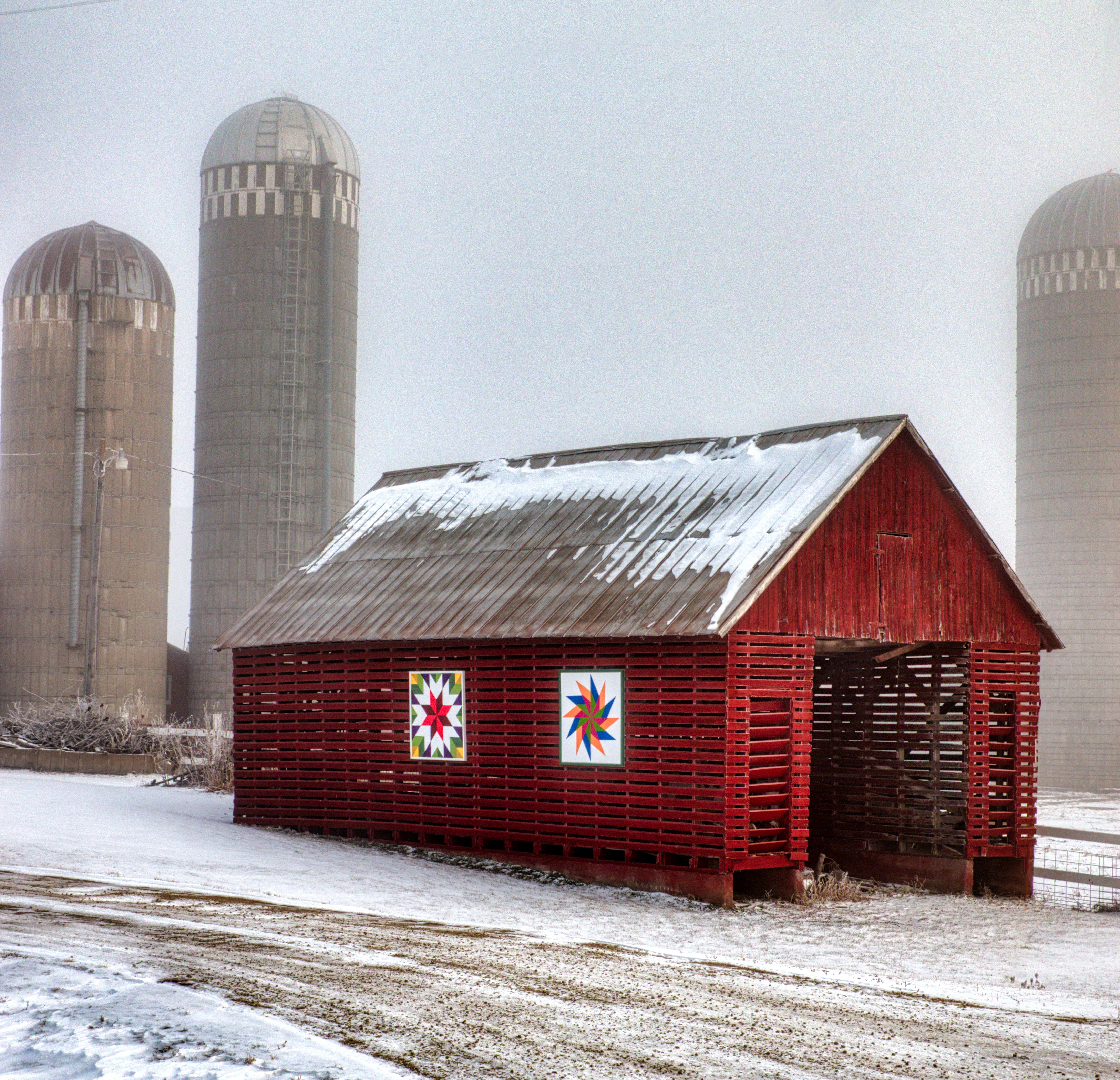 Red Wooden Building in Industrial Area · Free Stock Photo