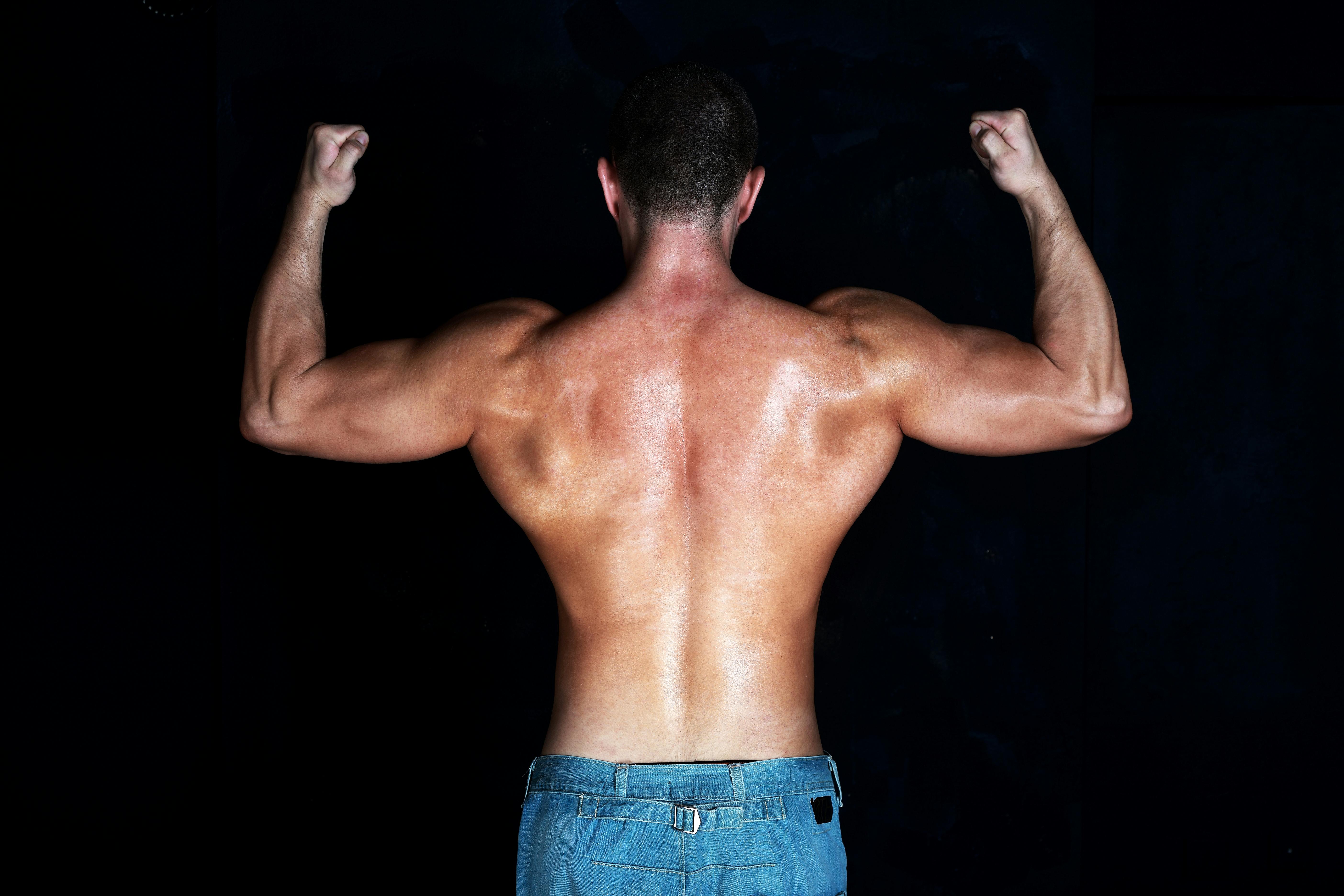 A Man Flexing His Muscles · Free Stock Photo