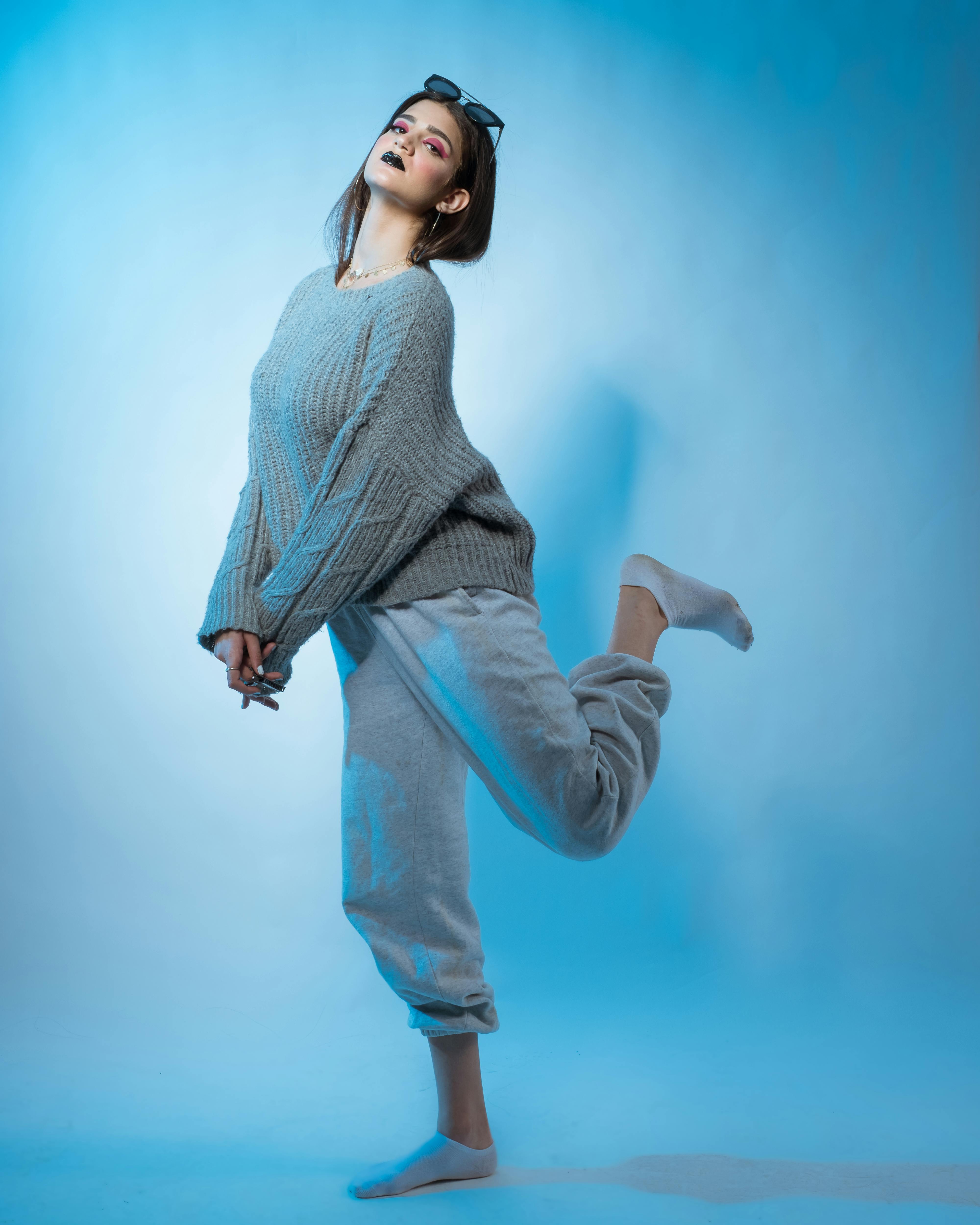 Woman in Gray Sweater Posing · Free Stock Photo