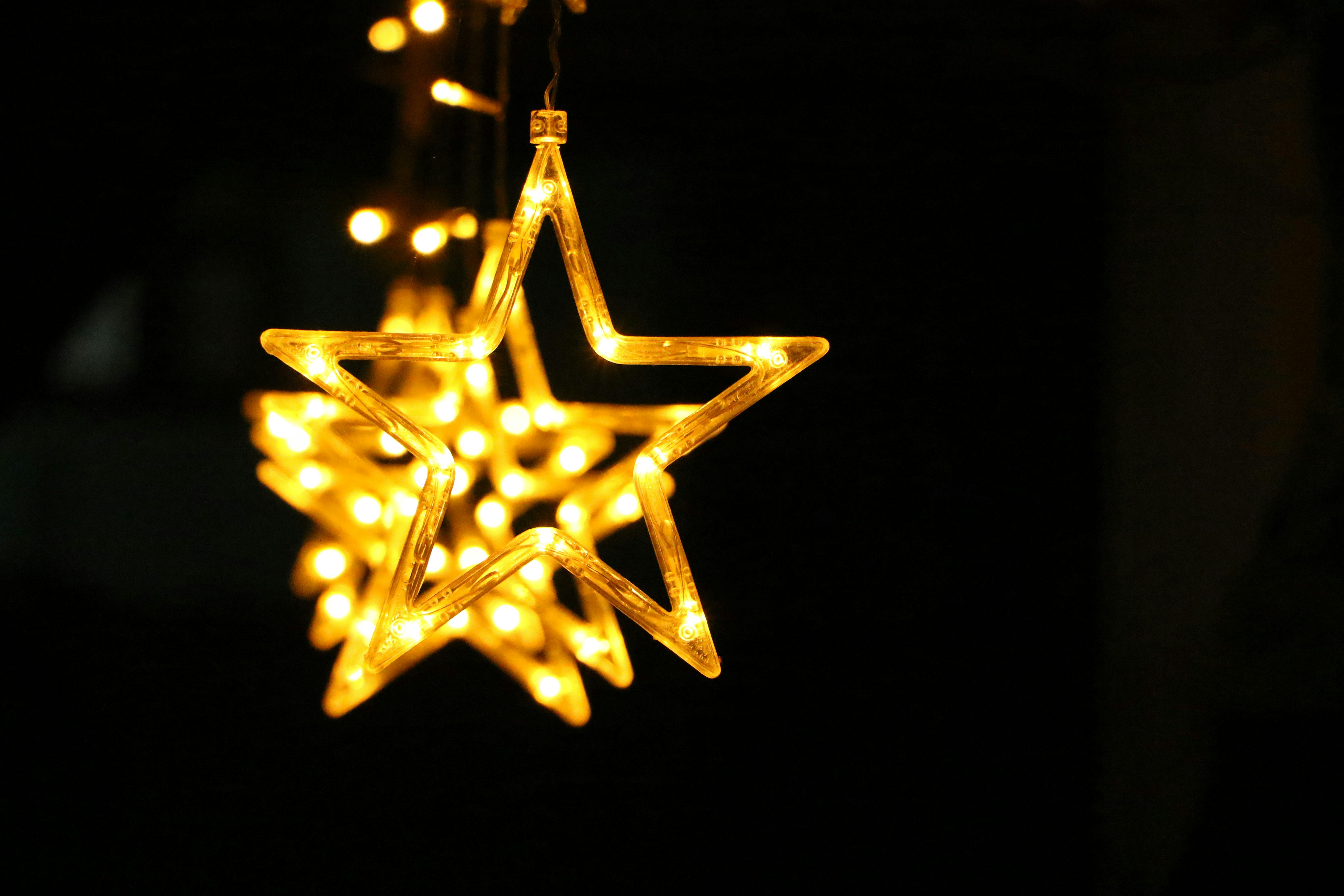 A Set of Yellow Star Lights During Night Time · Free Stock Photo