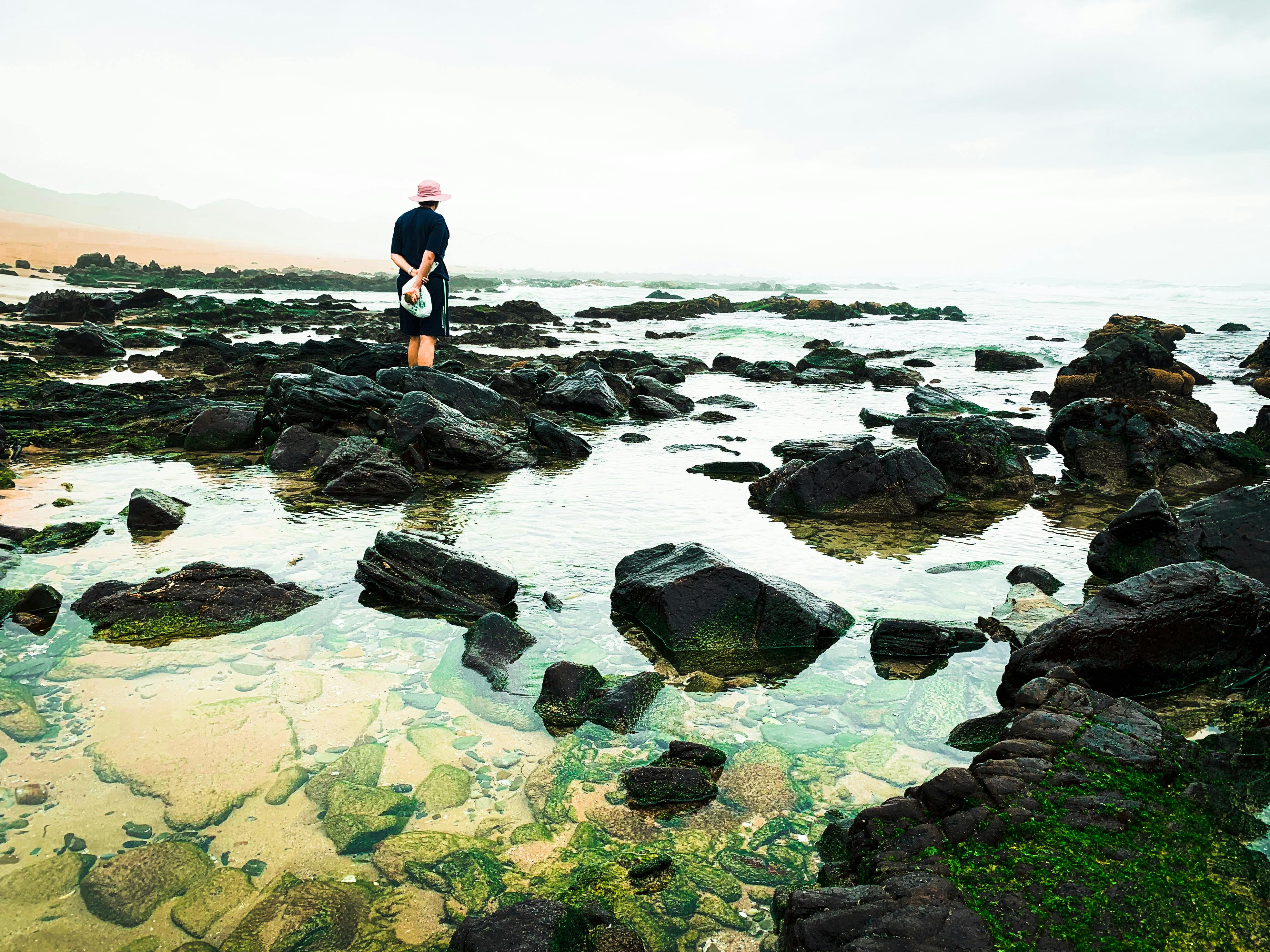 Person Standing in Rocks · Free Stock Photo