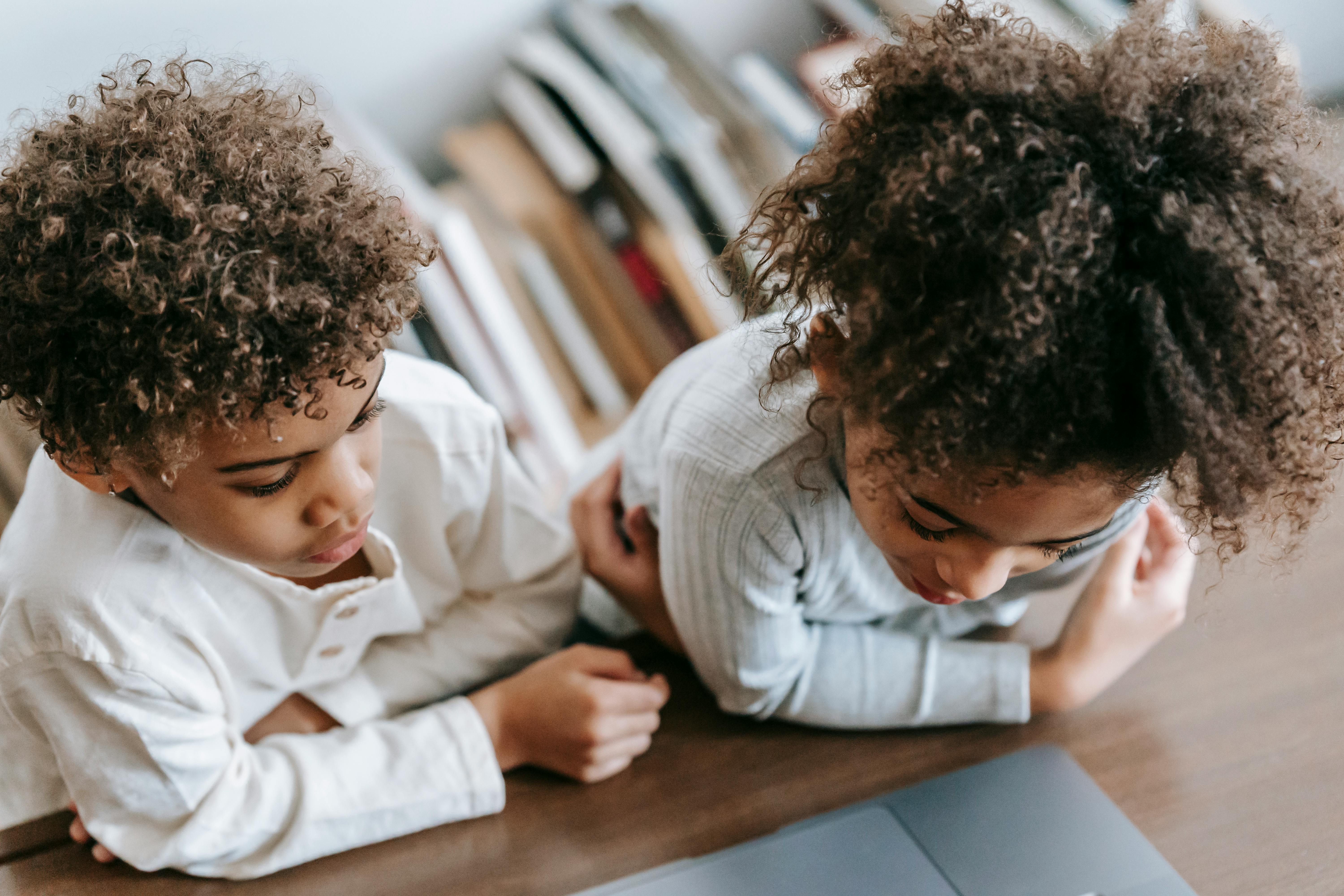 Black children at table with laptop · Free Stock Photo