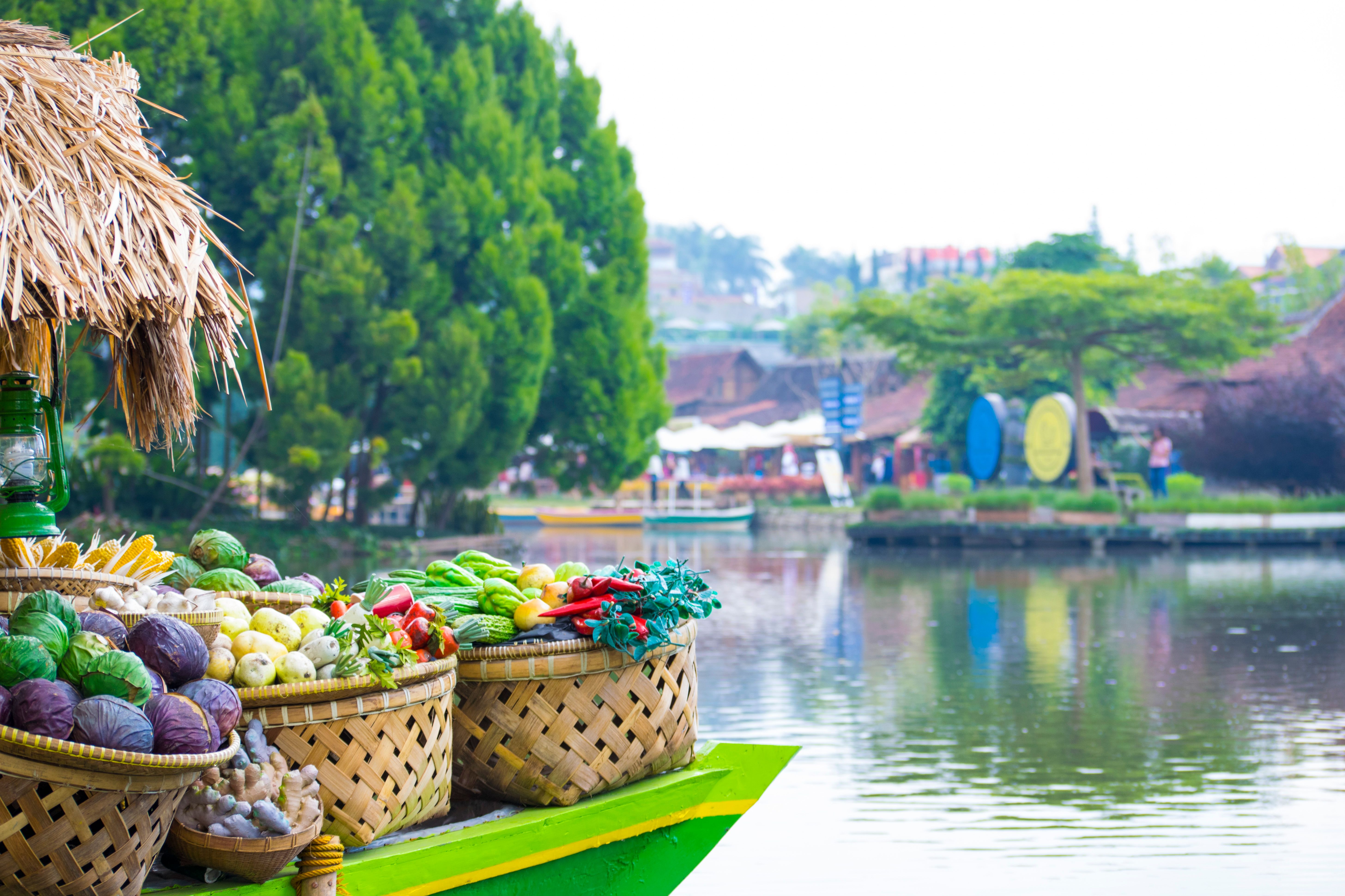 Fresh Fruit and Vegetables Sold on a Stall Near a Lake · Free Stock Photo