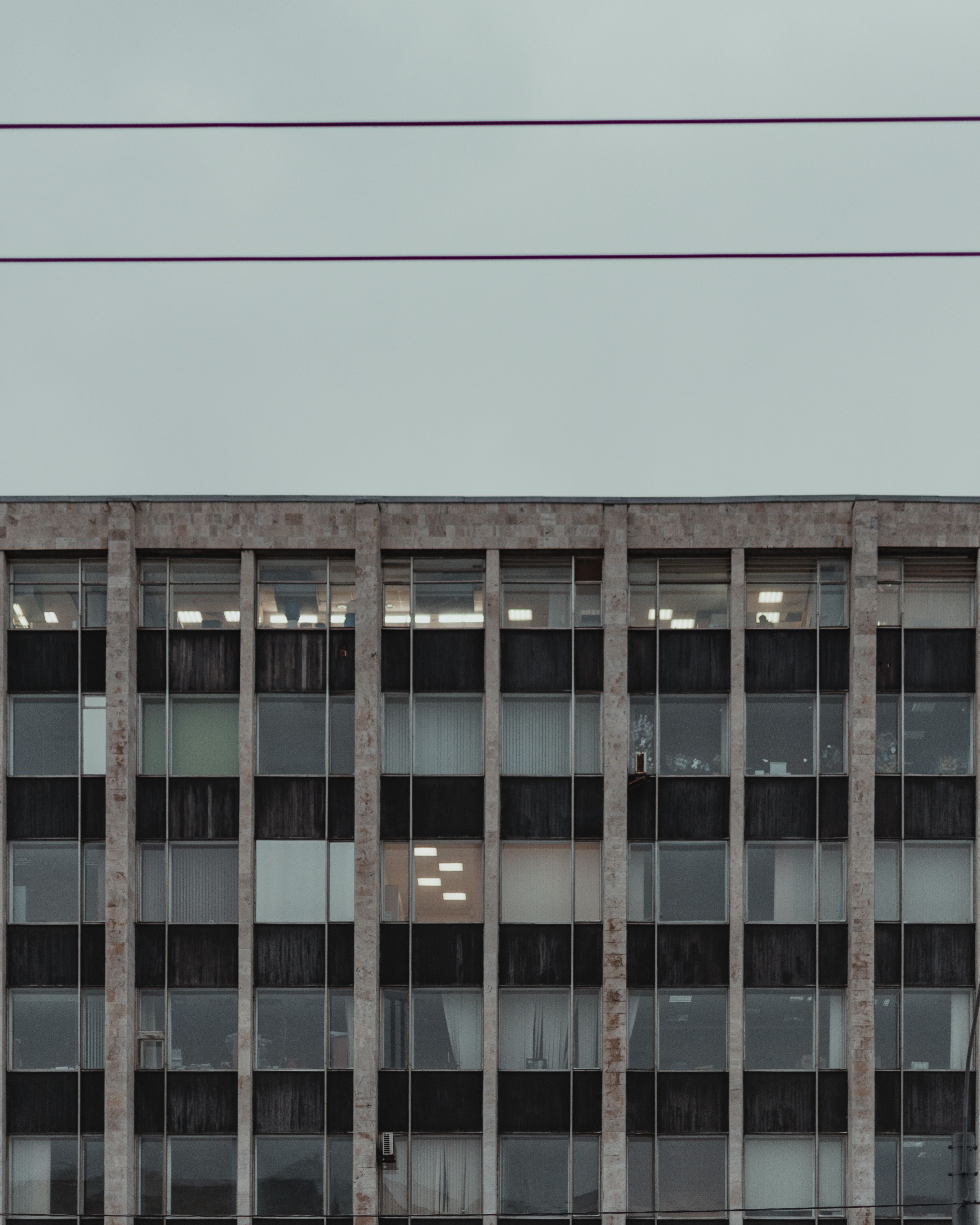 Modern building with tables on yard · Free Stock Photo