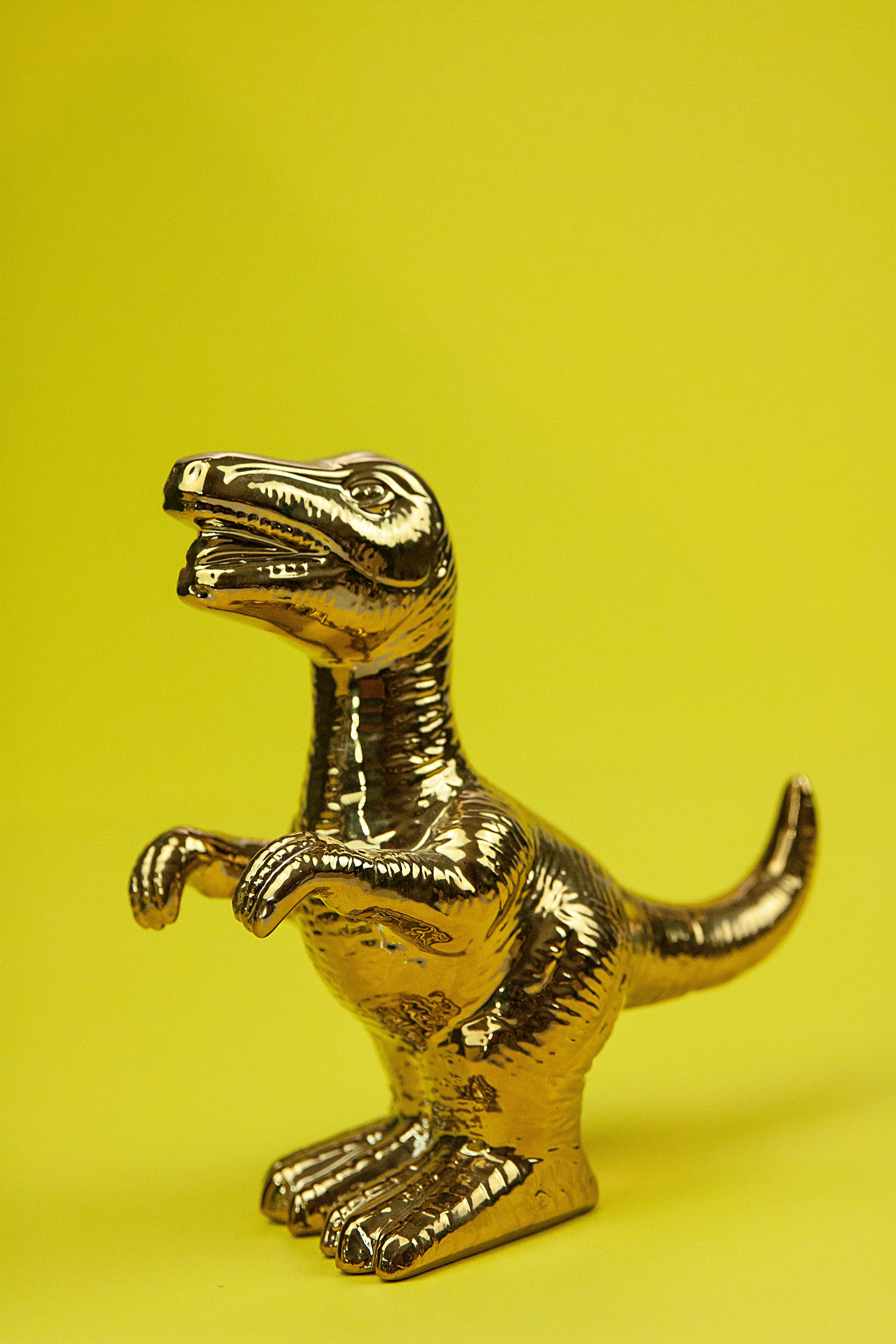 Gold Dinosaur Figurine · Free Stock Photo