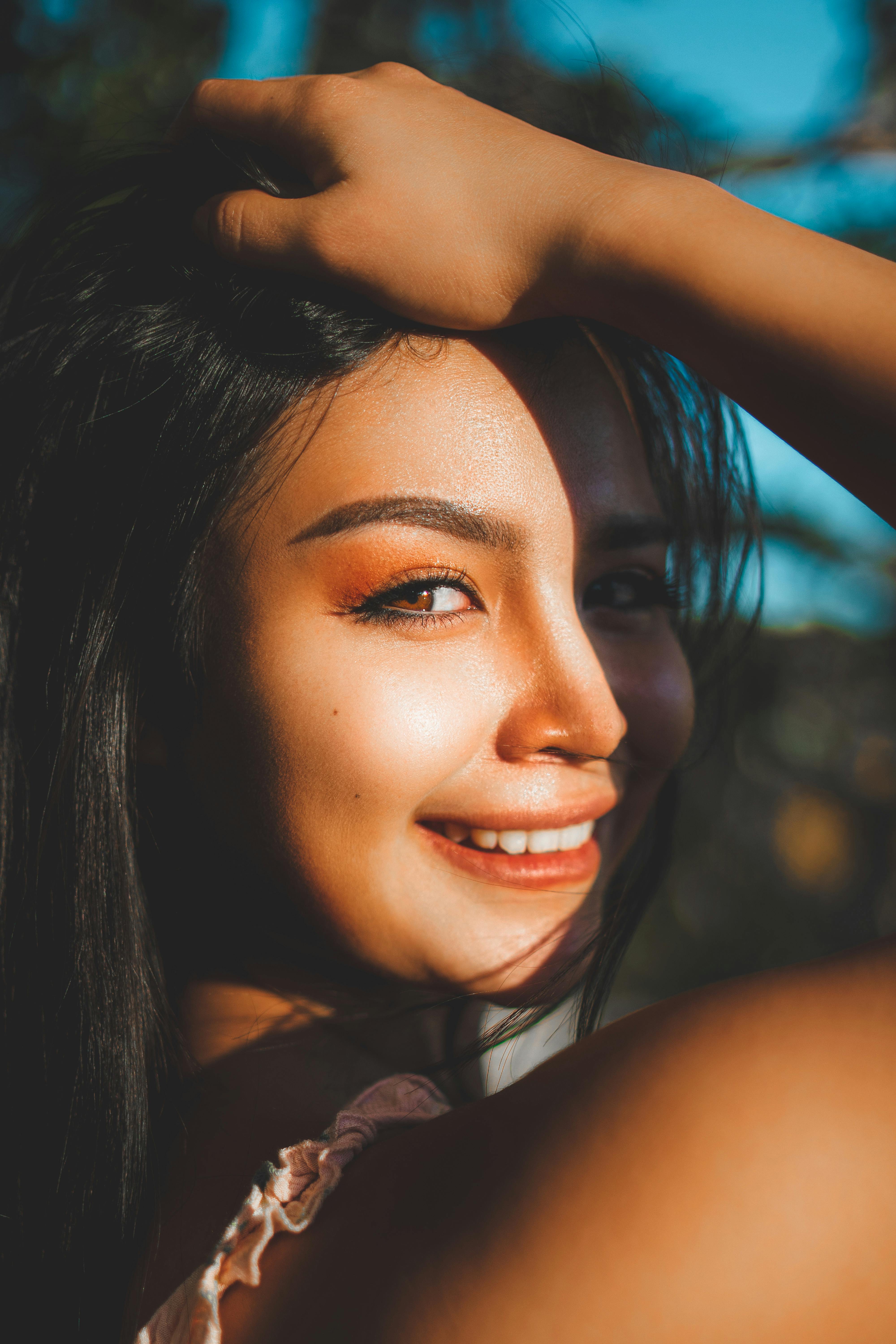 A Smiling Woman in a Pose · Free Stock Photo