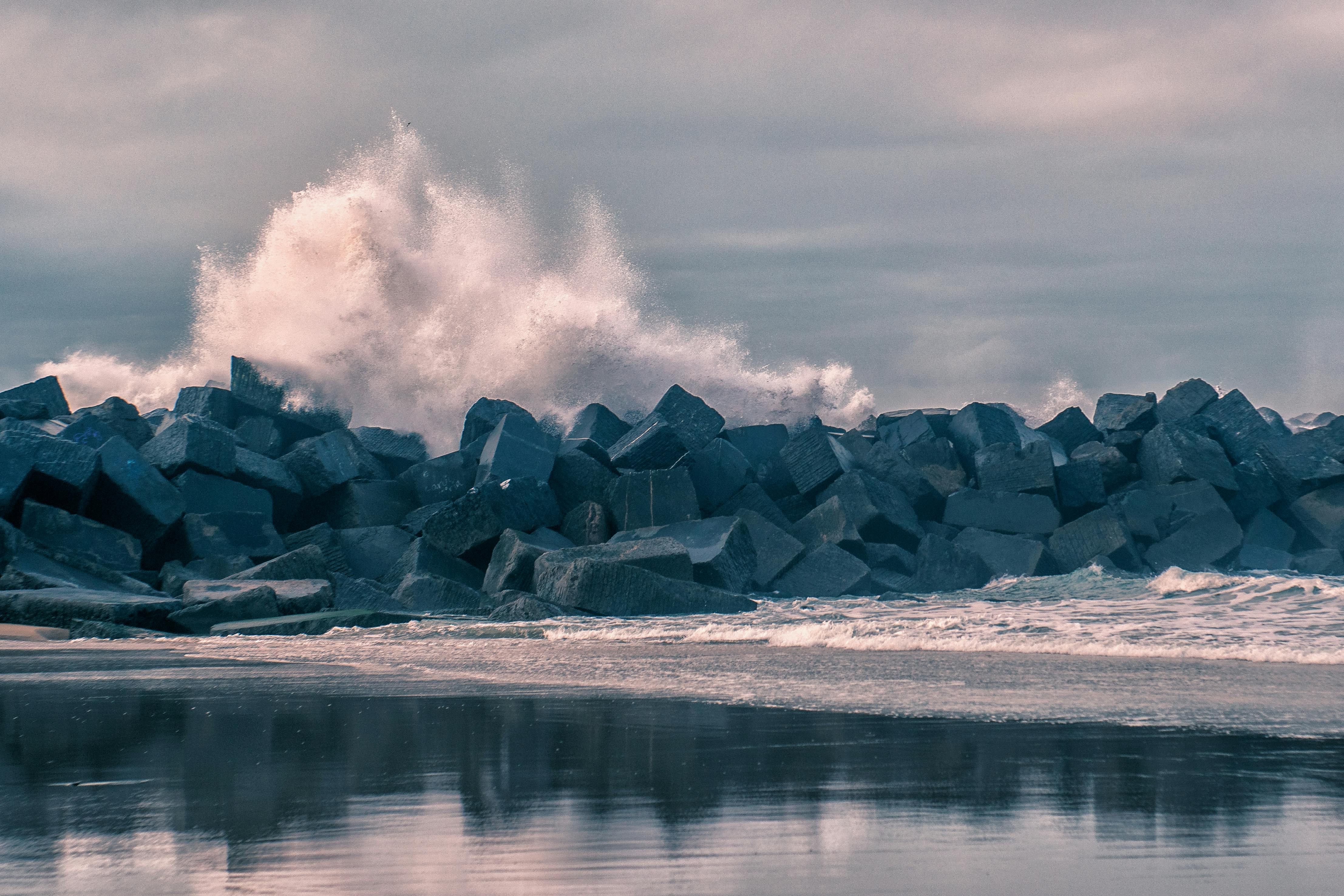 Wall of Rocks on the Beach for Breaking Waves · Free Stock Photo