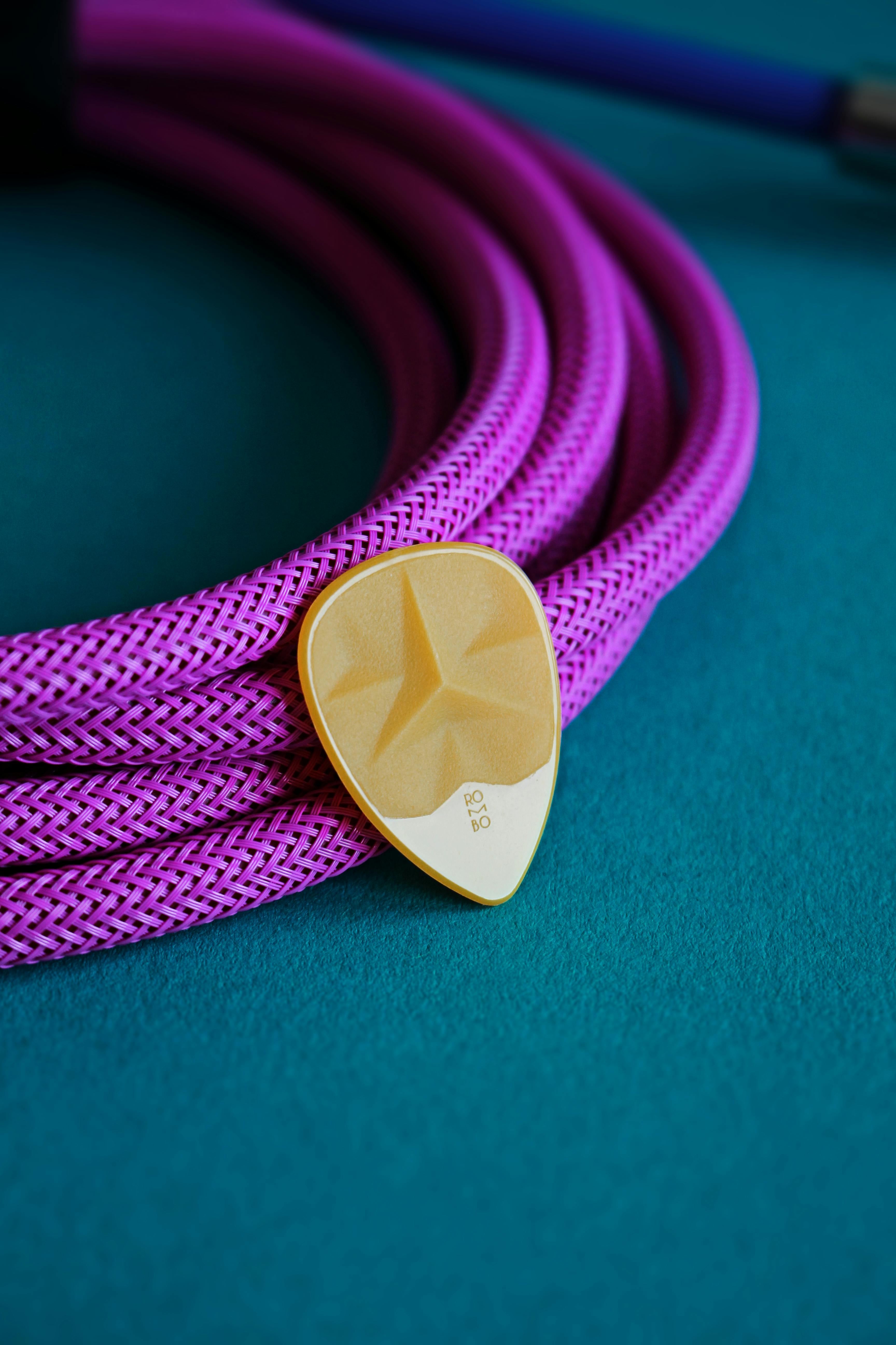 Shallow Focus Photo of Pink Guitar Pick · Free Stock Photo