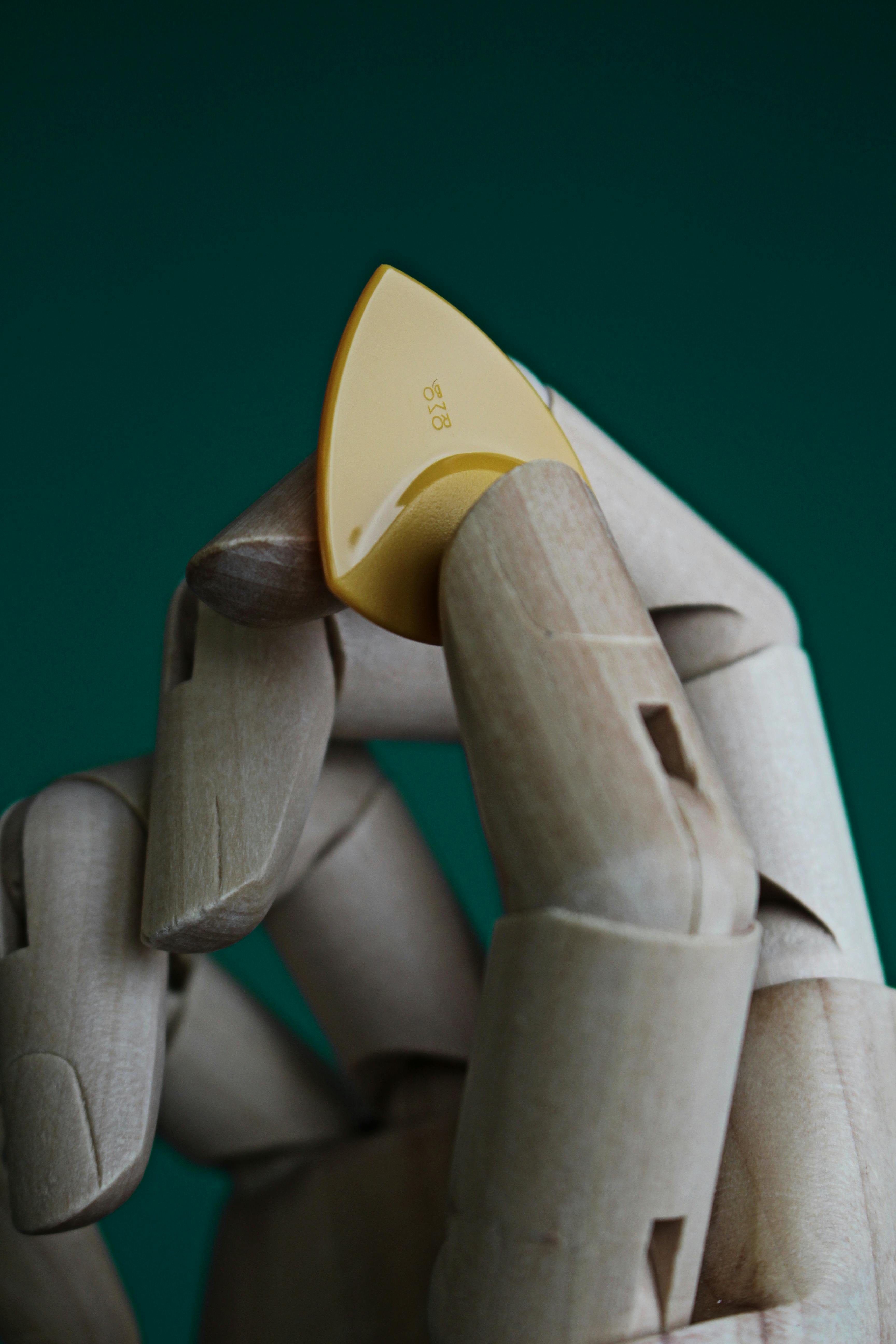 A Hand Getting a Piece of Jenga · Free Stock Photo