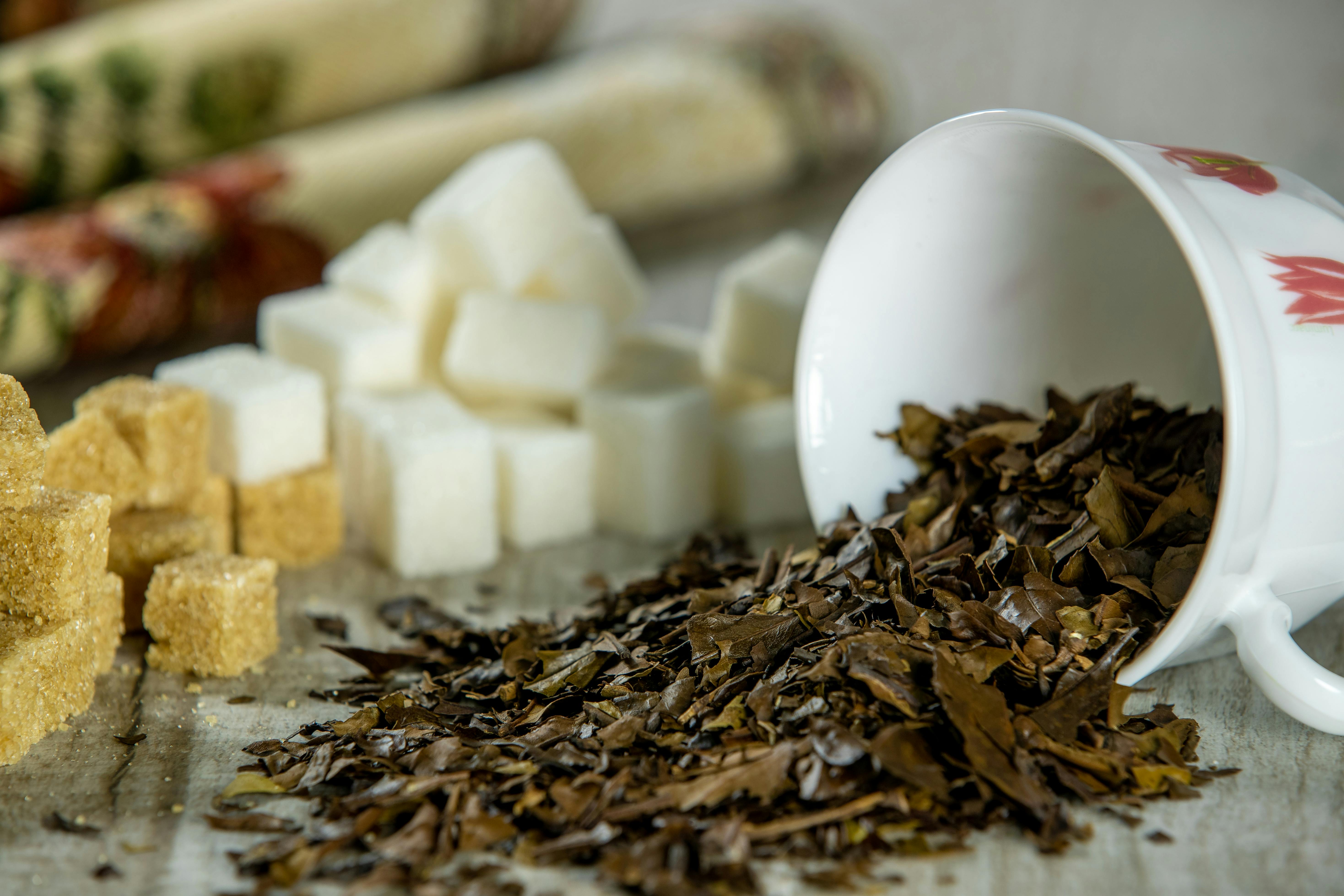 Tea Leaves Falling out of a Cup · Free Stock Photo