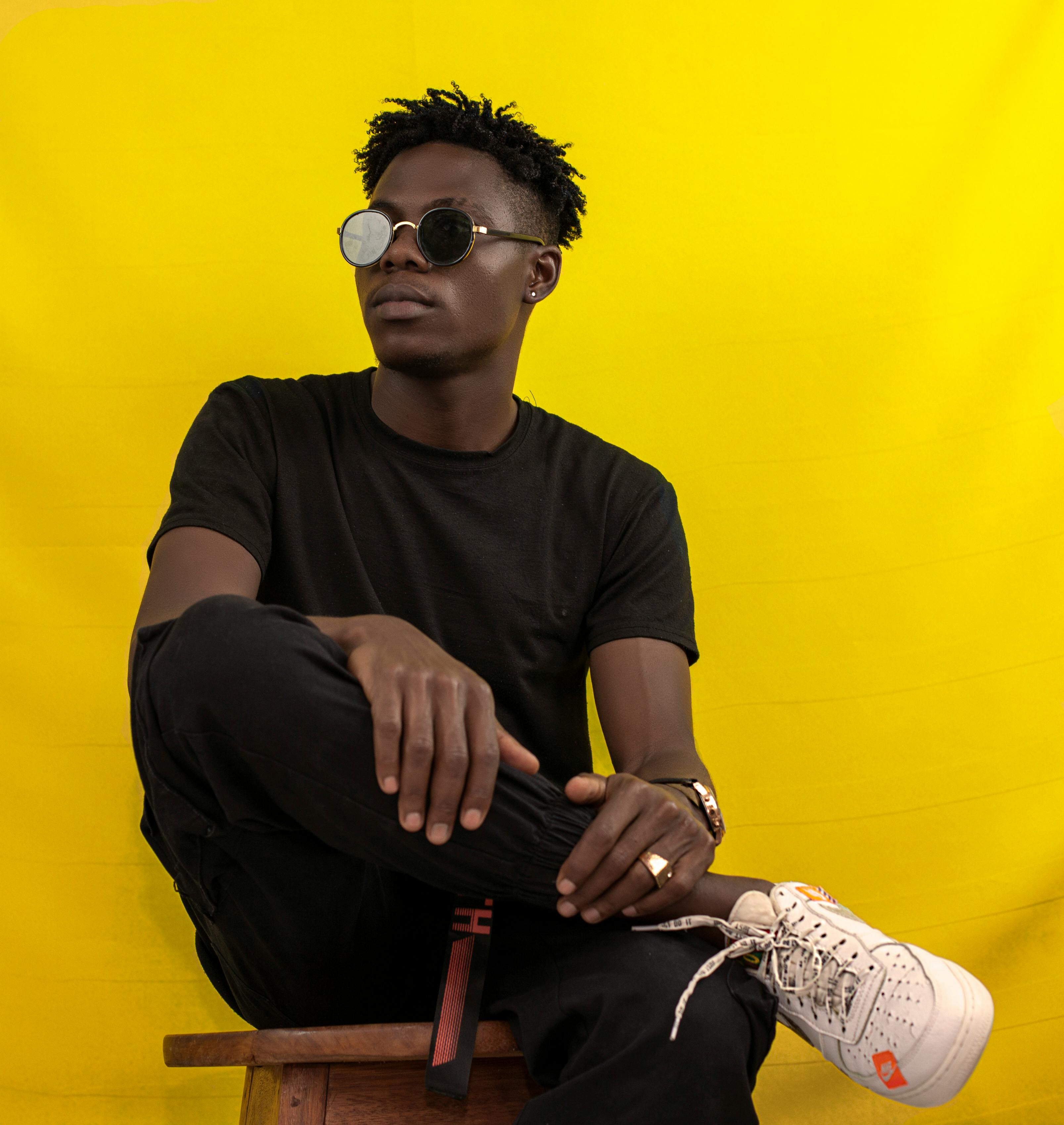 A Man Wearing Shell Accessories and a Straw Hat · Free Stock Photo