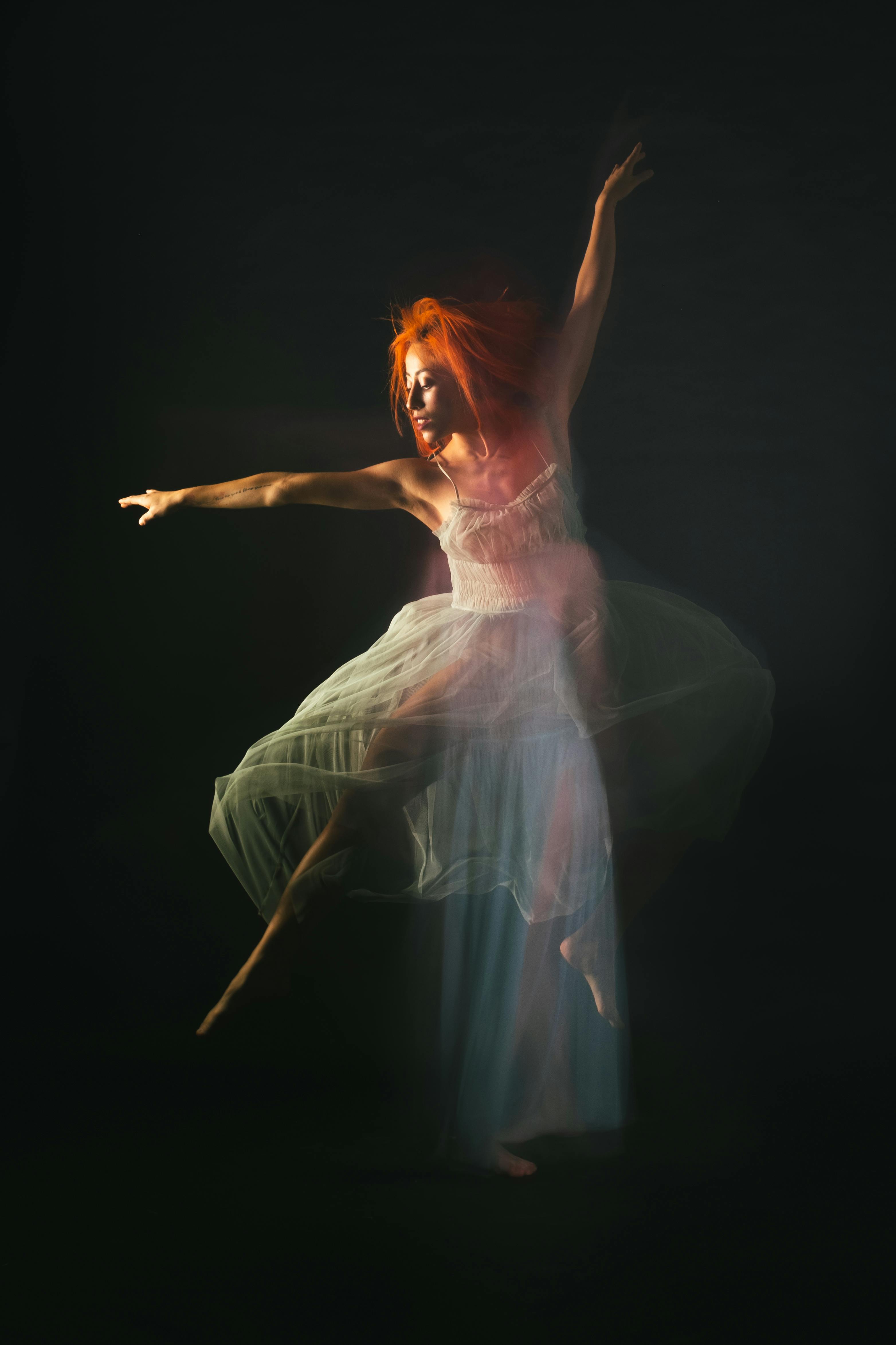 Brunette Woman Dancing with Messy Hair · Free Stock Photo