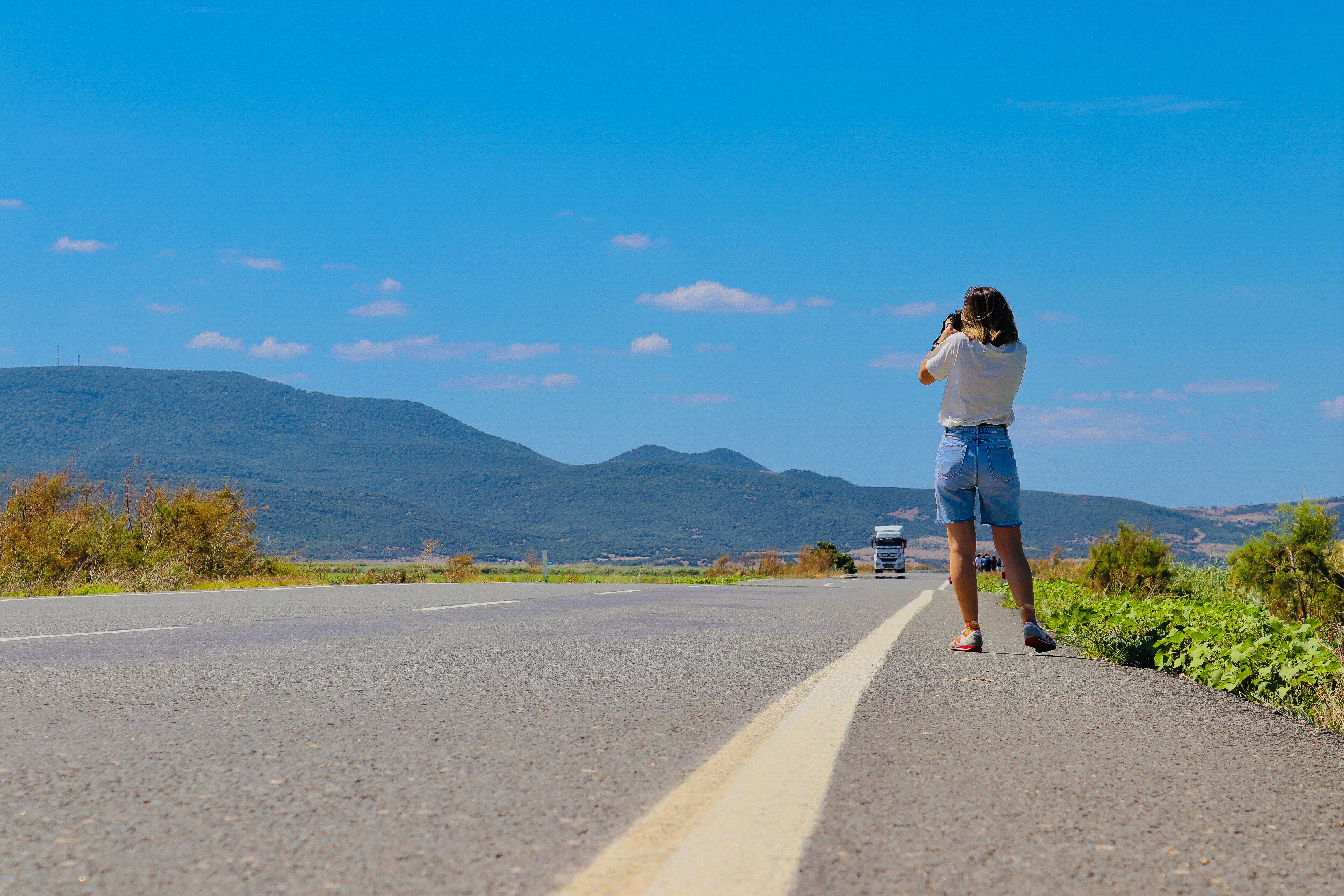 Woman Standing on Roadside · Free Stock Photo