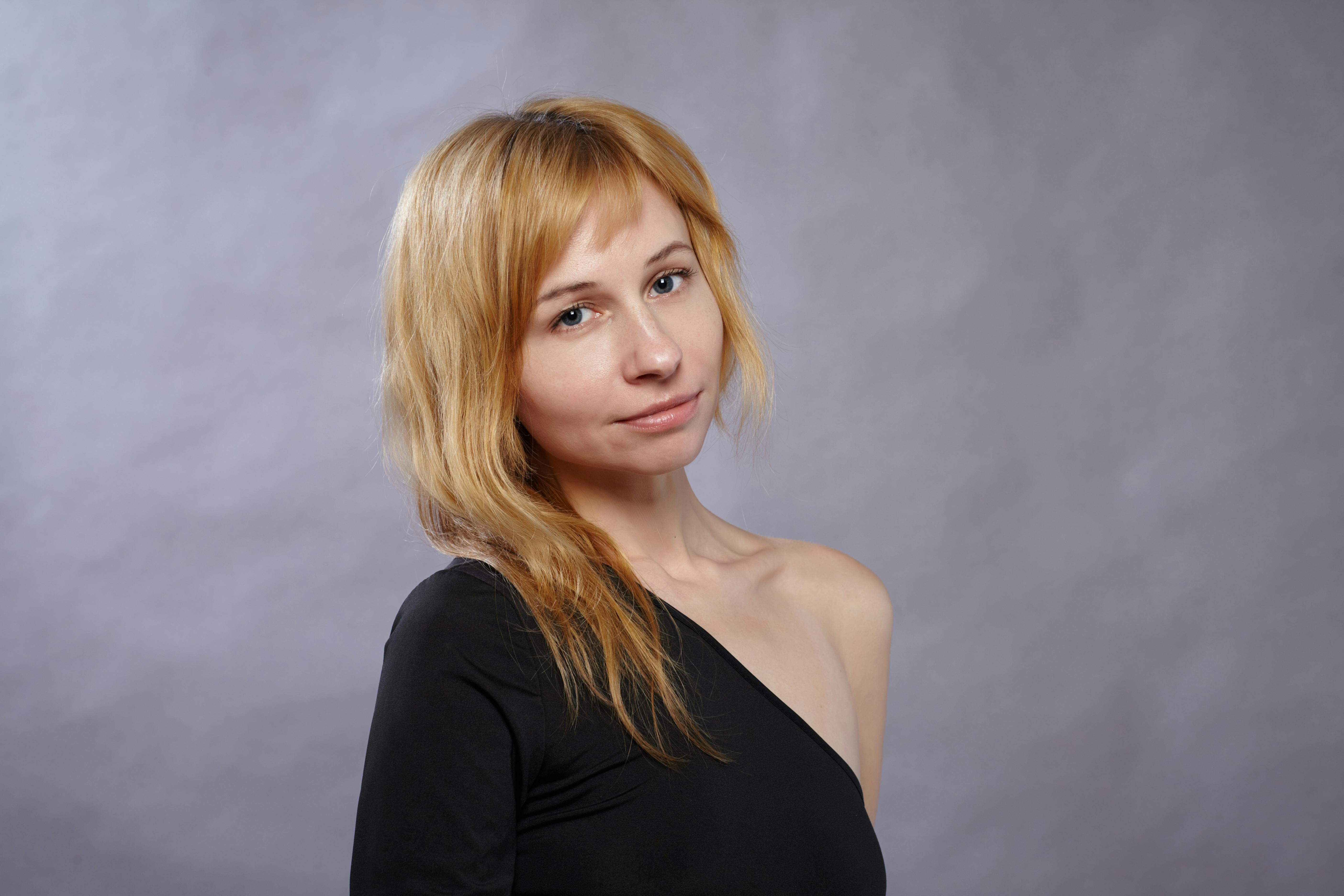 Woman Posing On A Concrete Post · Free Stock Photo