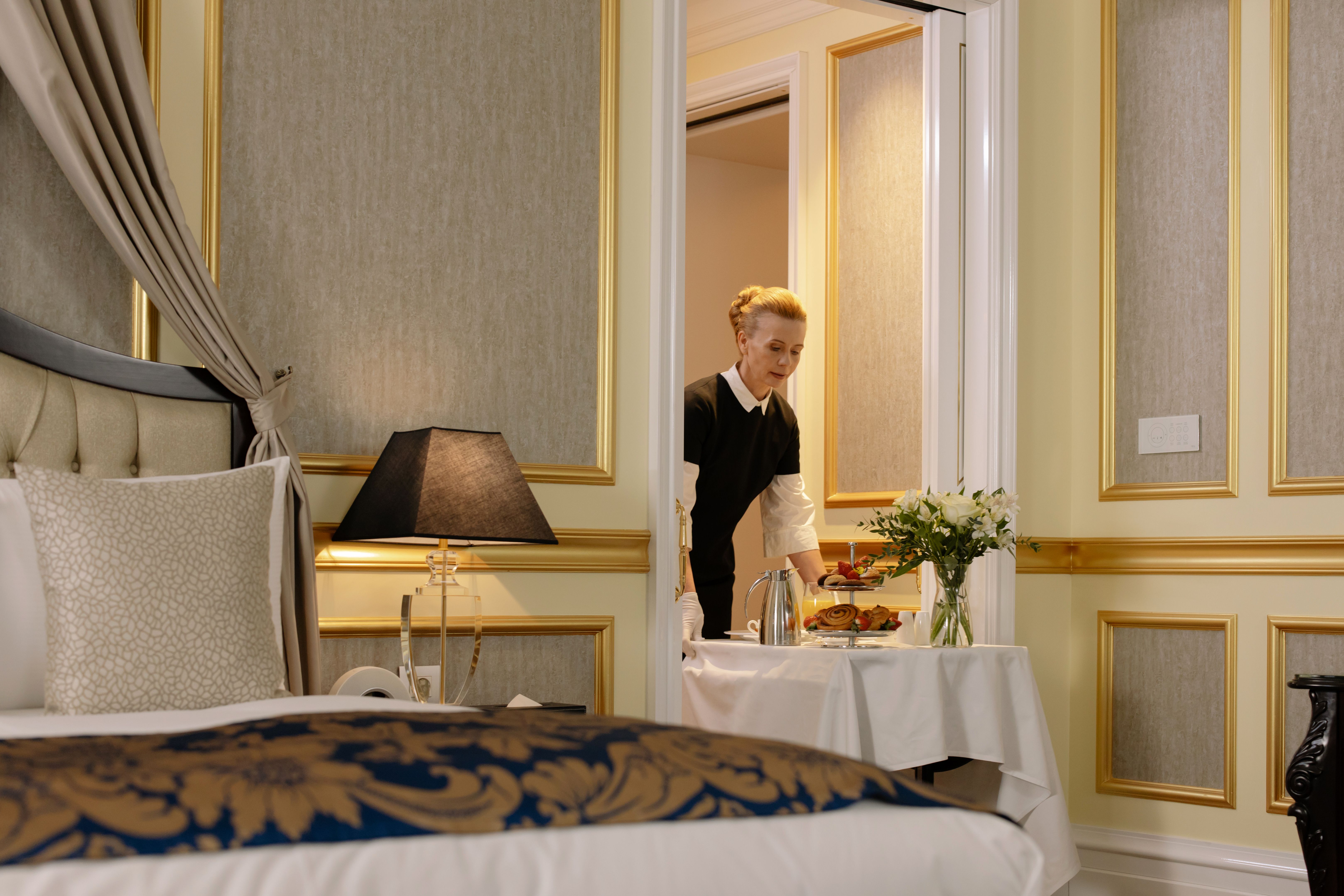 Woman Serving Order on Hotel Room Service · Free Stock Photo