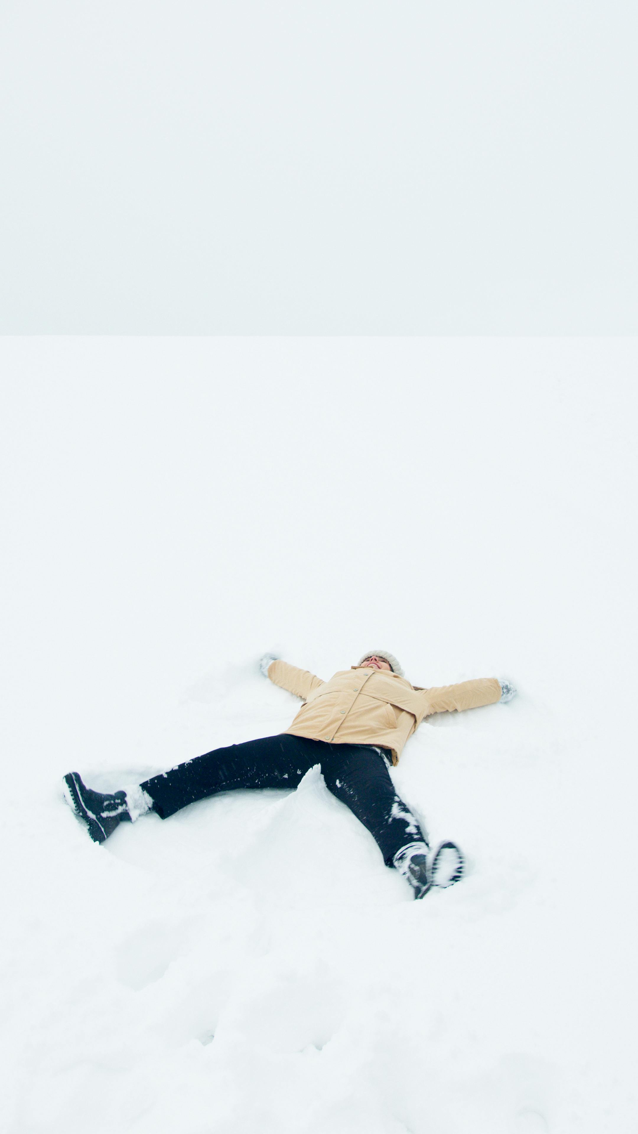 A Person Lying Down on Snow · Free Stock Photo