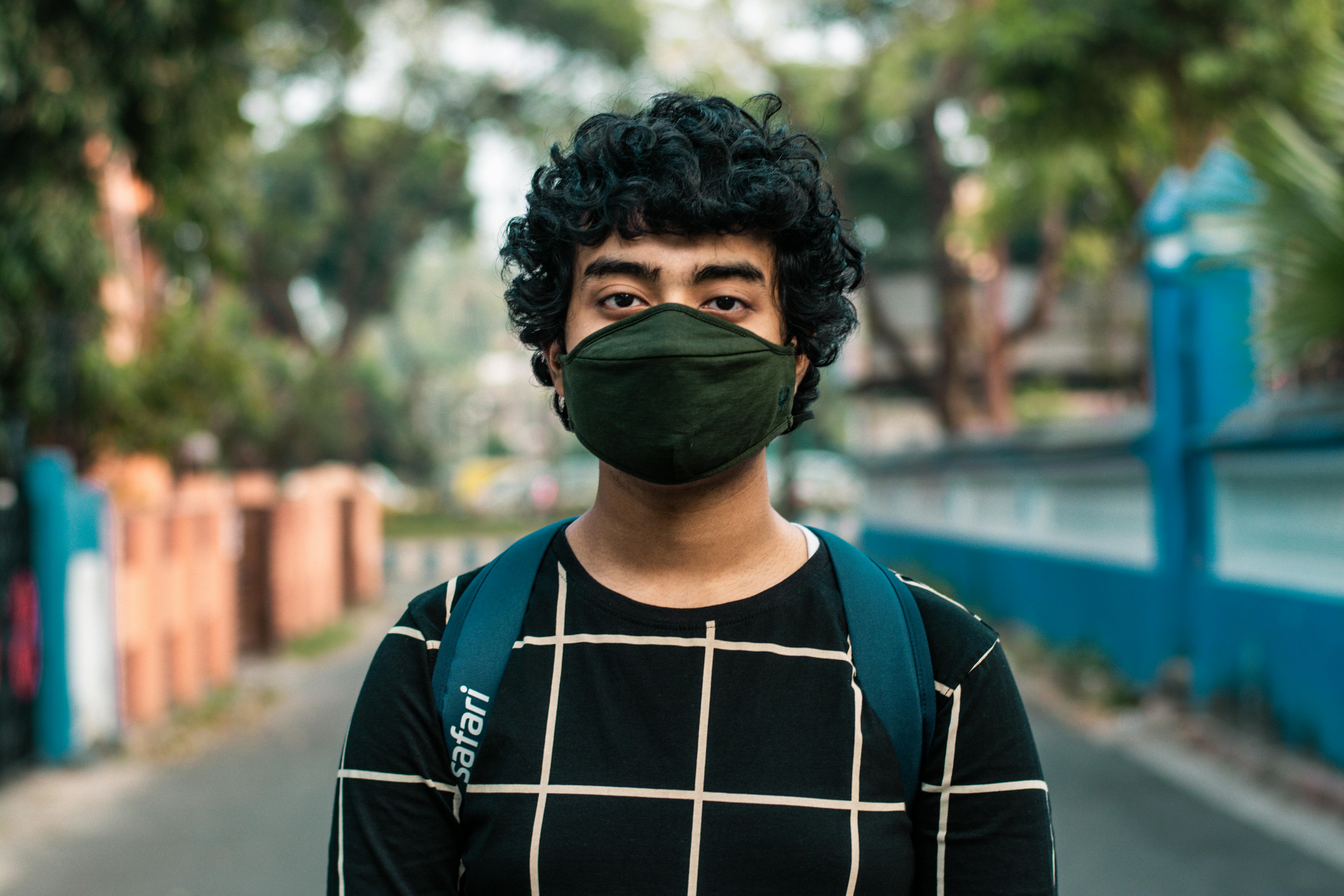 Man with Black Face Mask Standing on the Street · Free Stock Photo