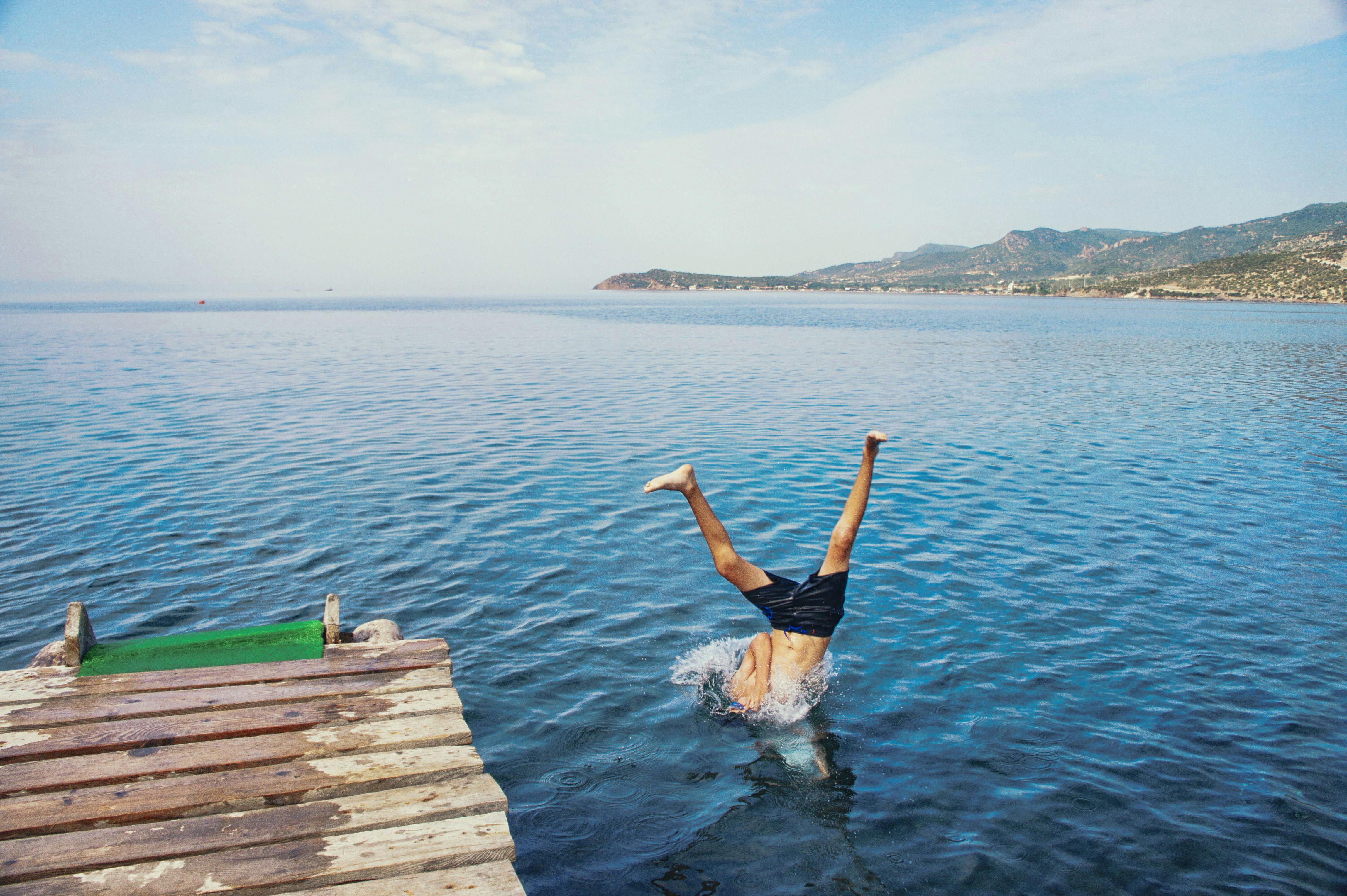 Man Diving in the Ocean · Free Stock Photo