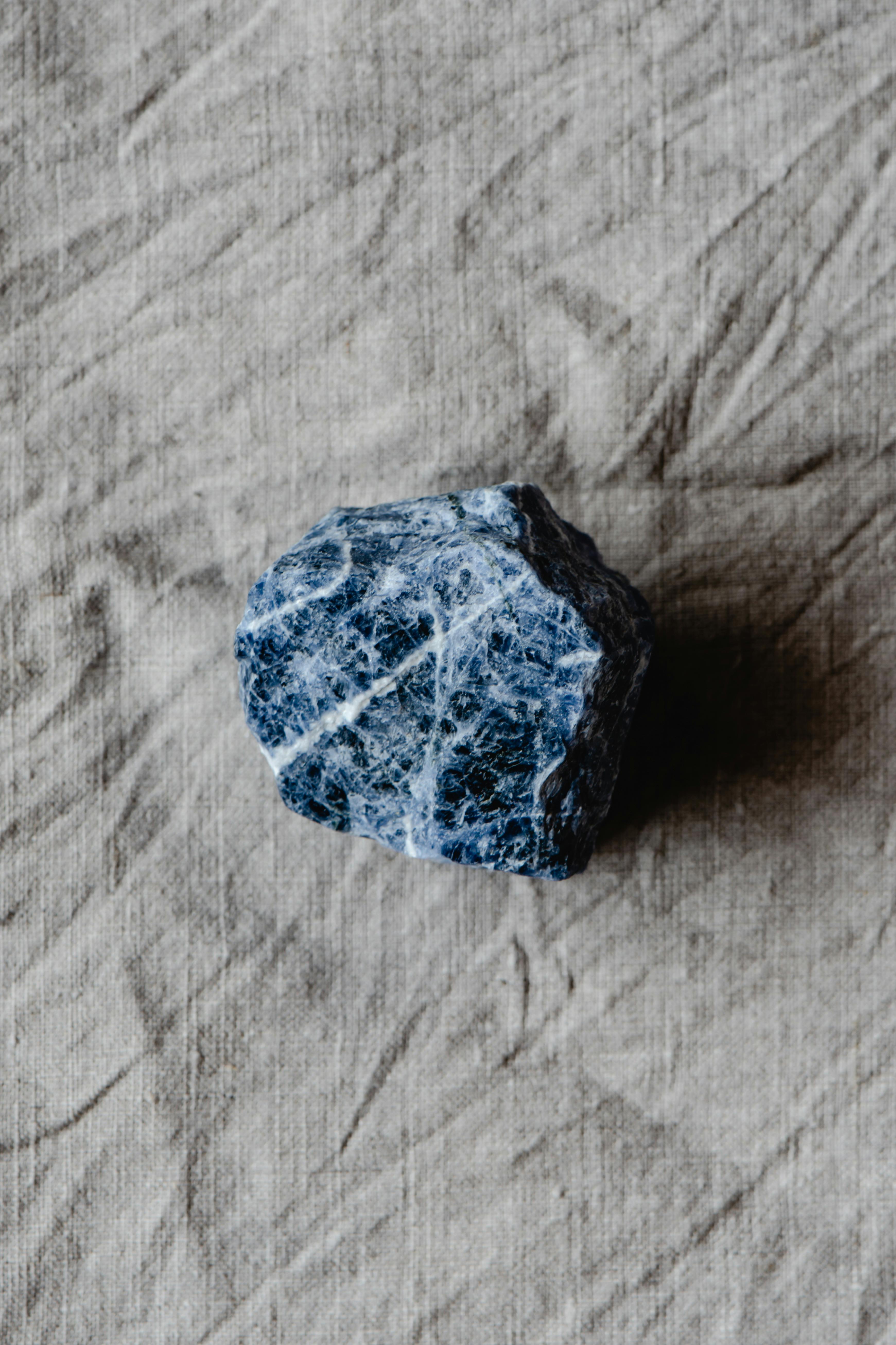 Cordierite Stone on Fabric · Free Stock Photo