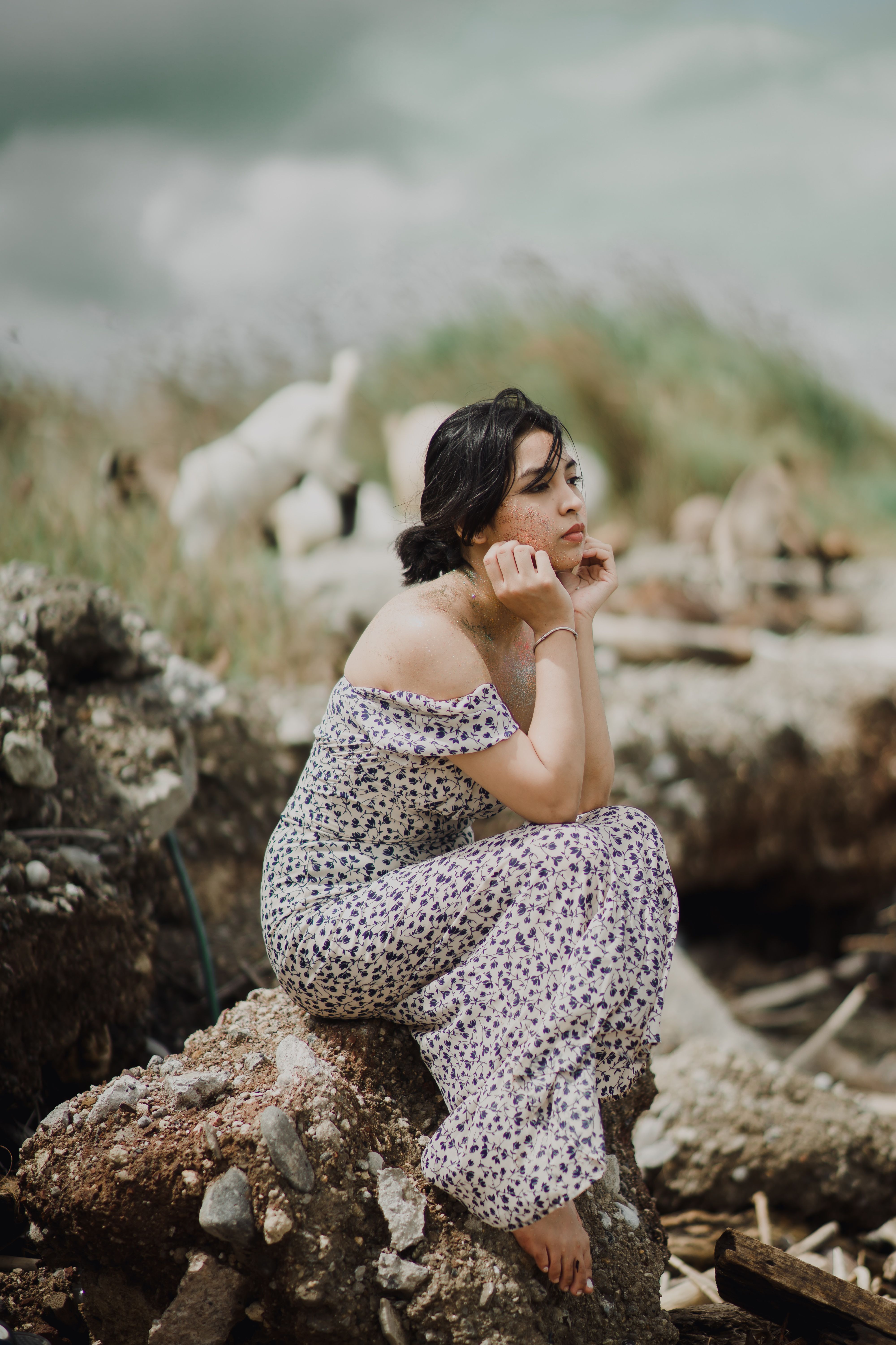 Romantic Asian traveler contemplating sea under light sky · Free Stock ...