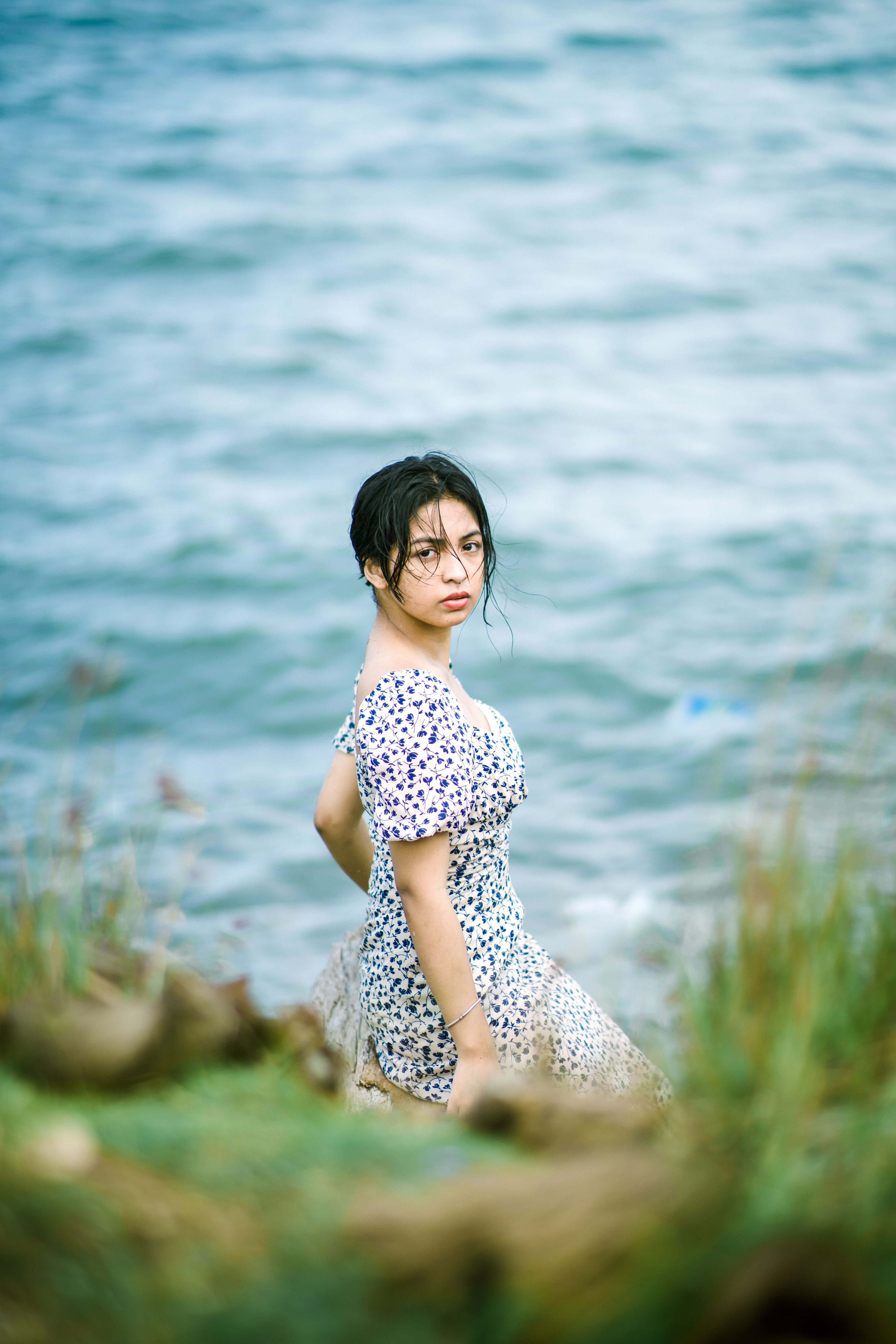 Romantic Asian traveler contemplating sea under light sky · Free Stock ...