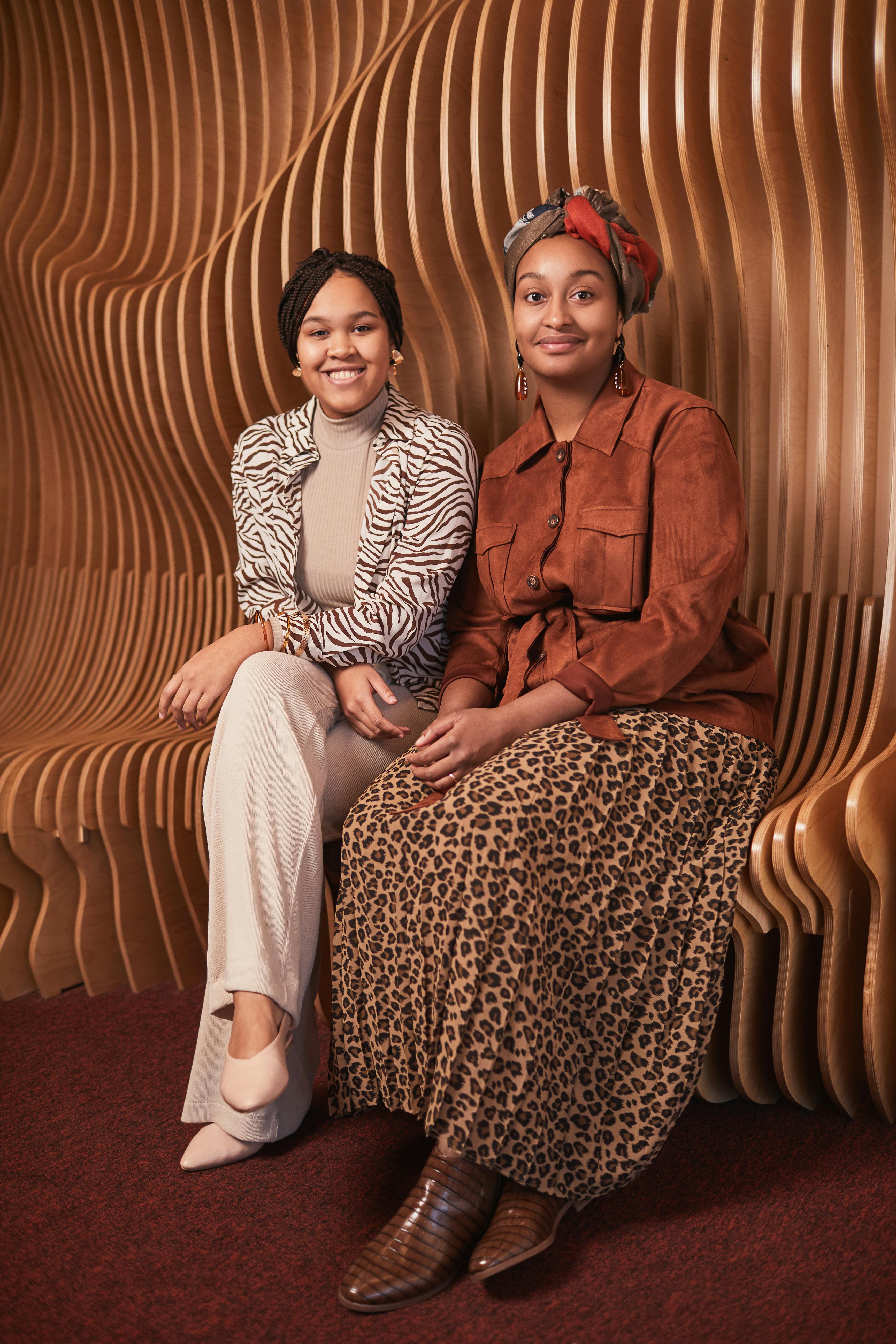 Stylish Women Sitting Together · Free Stock Photo