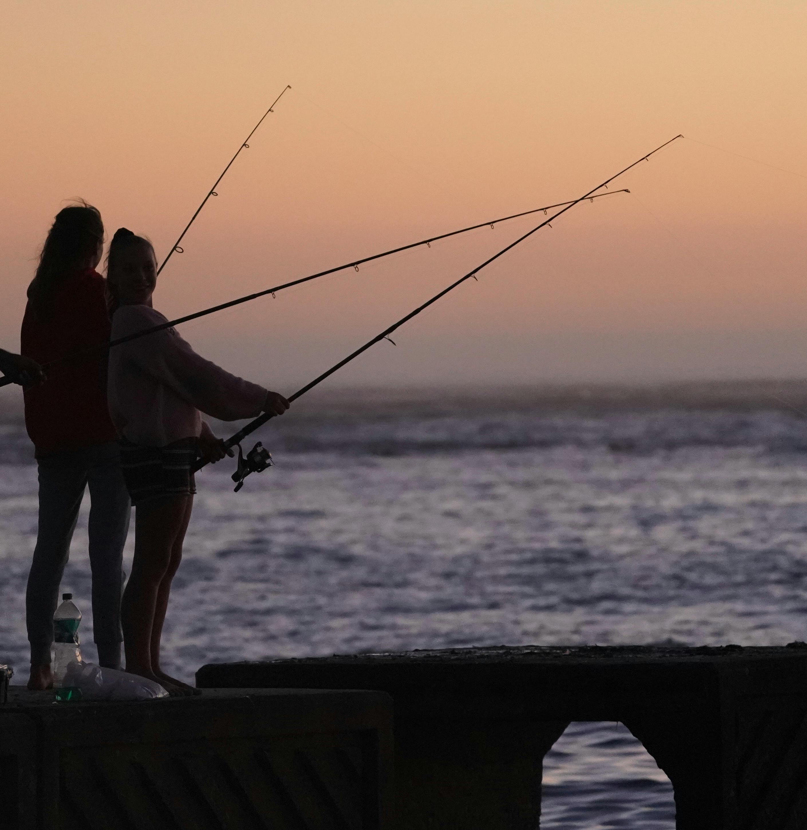 Women Fishing During Sunset · Free Stock Photo