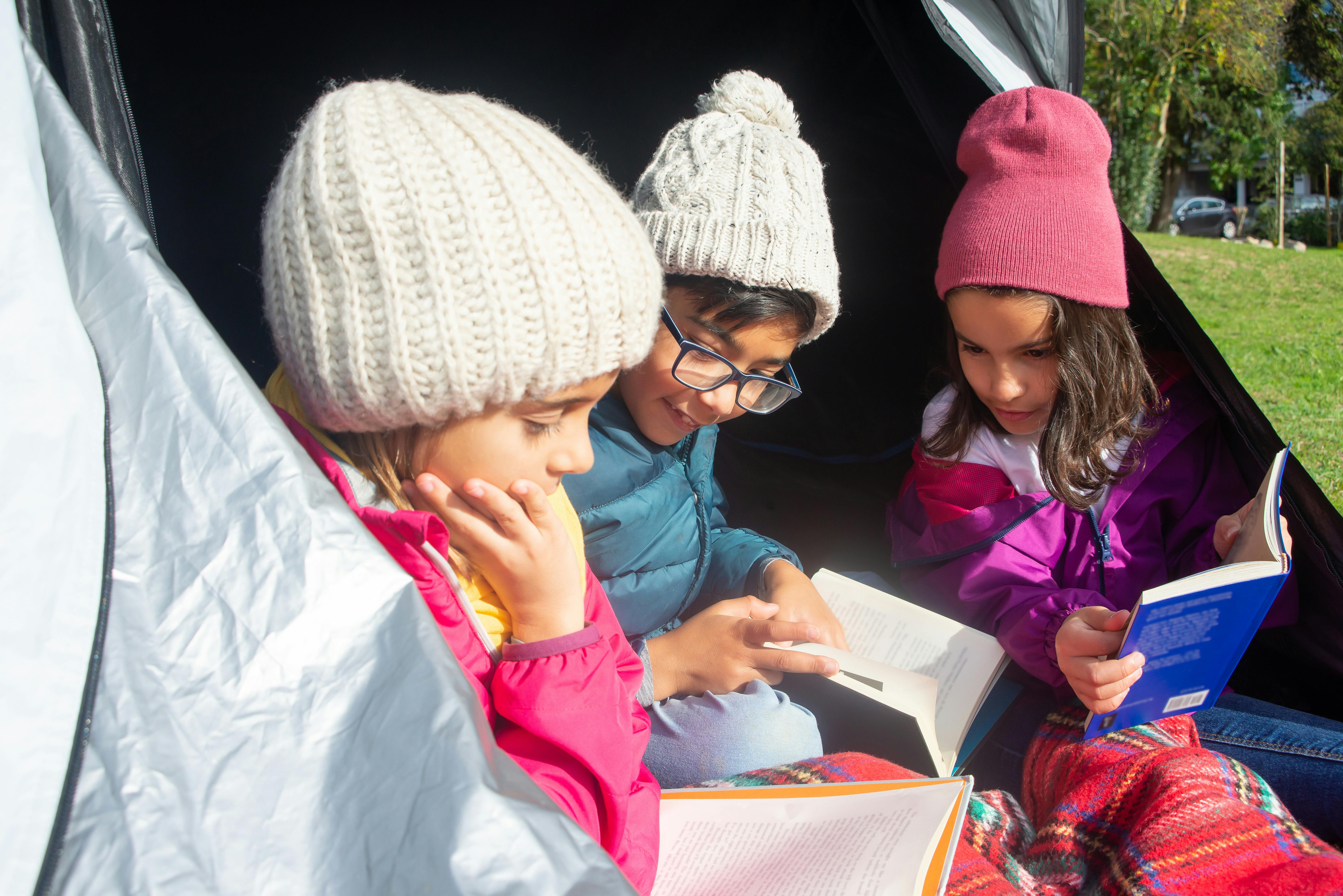 Kids Inside a Tent Reading Books · Free Stock Photo