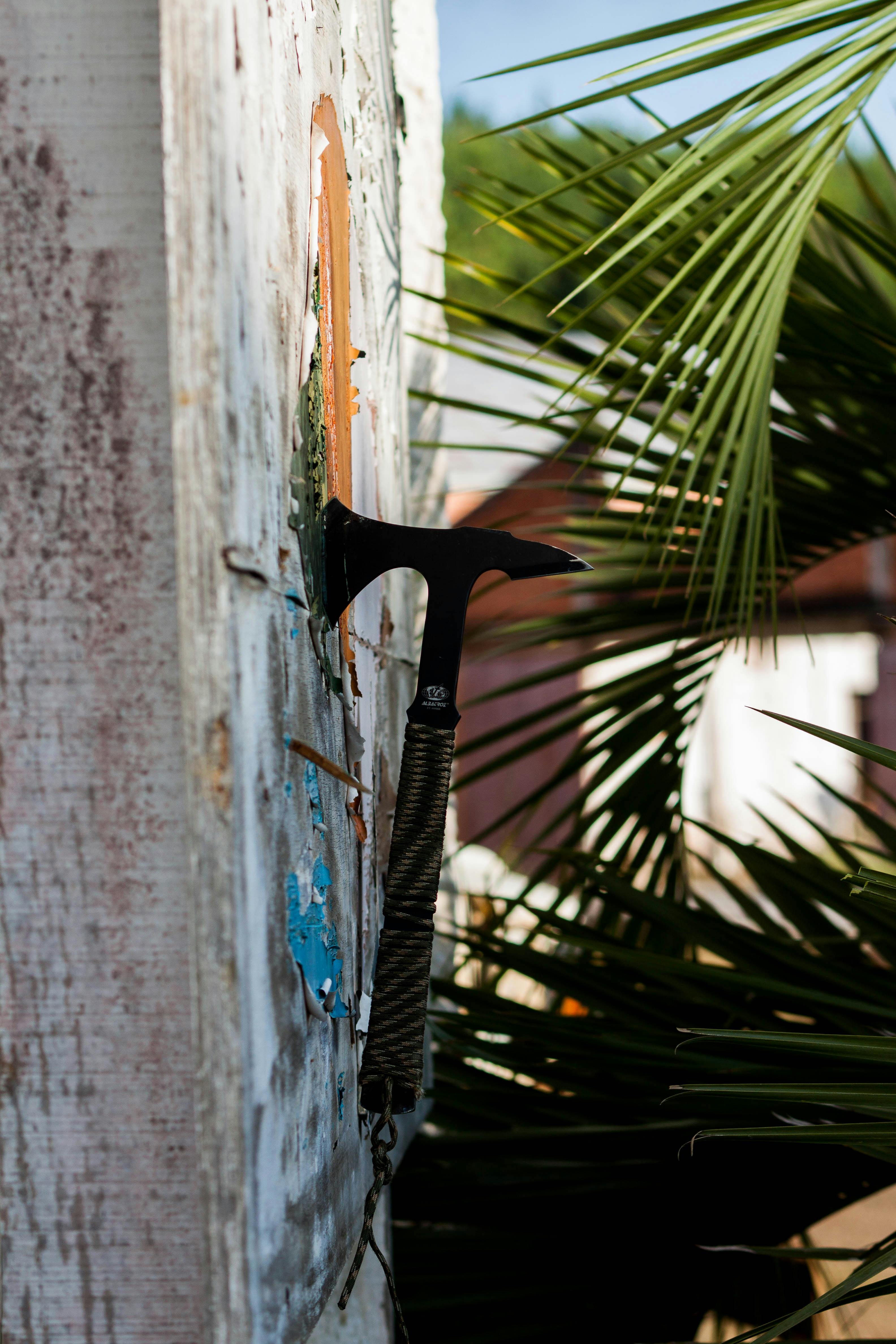 Brown Wooden Axe Besides Brown Leather Knife Holster · Free Stock Photo