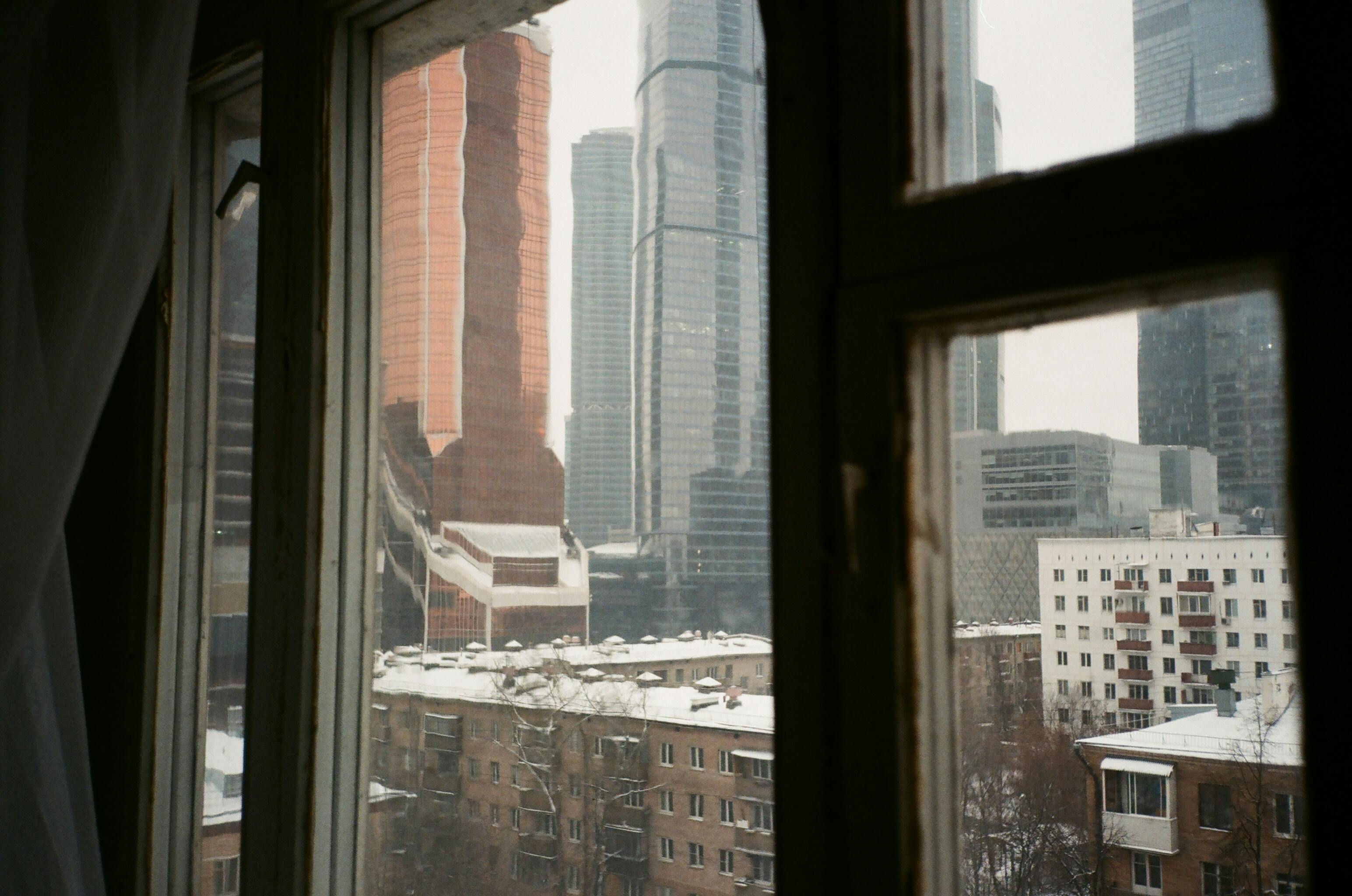 From window view of urban city architecture on winter · Free Stock Photo