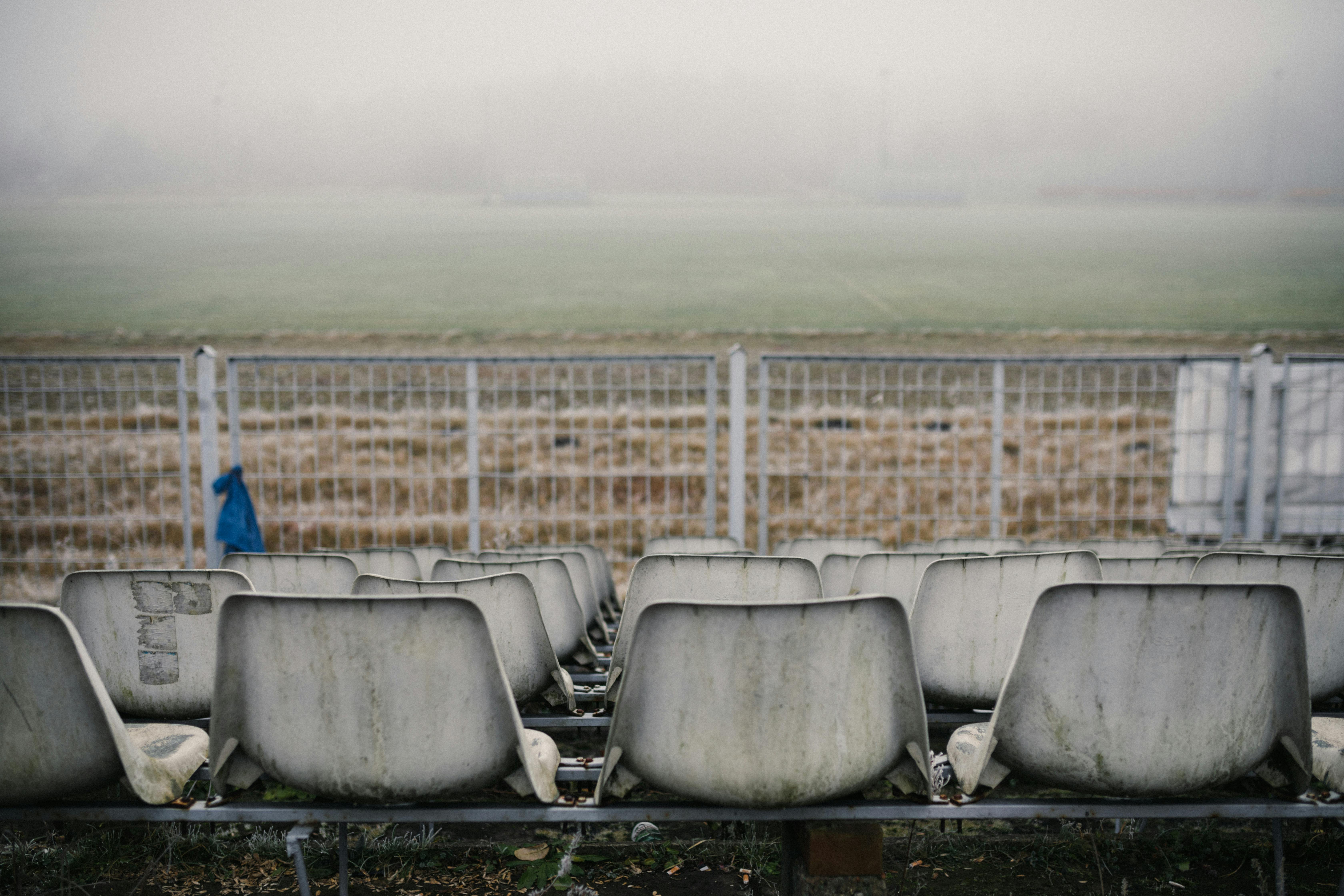 Dirty Seats in the Football Field Bleachers · Free Stock Photo