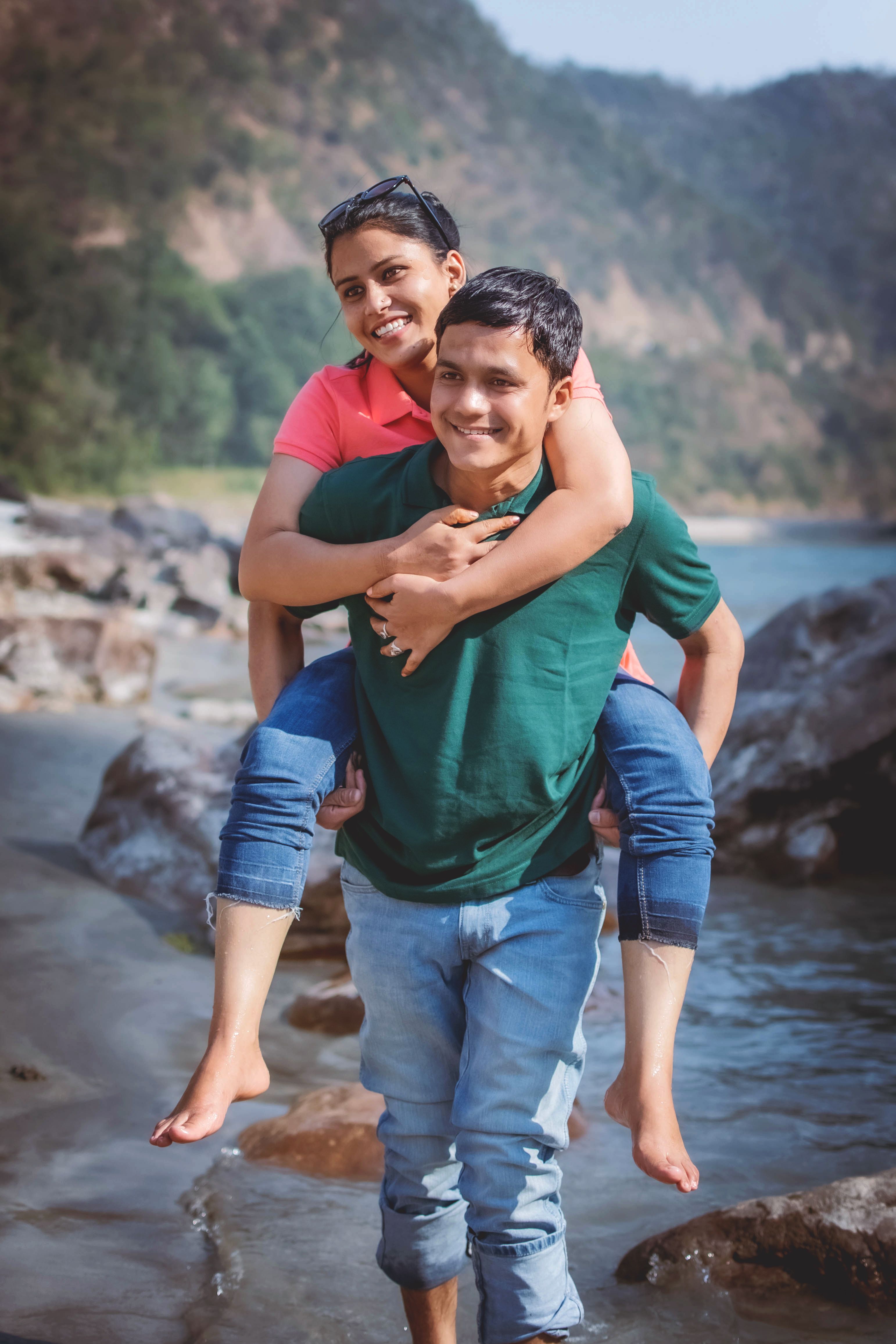 Smiling Woman Riding on Man's Back · Free Stock Photo
