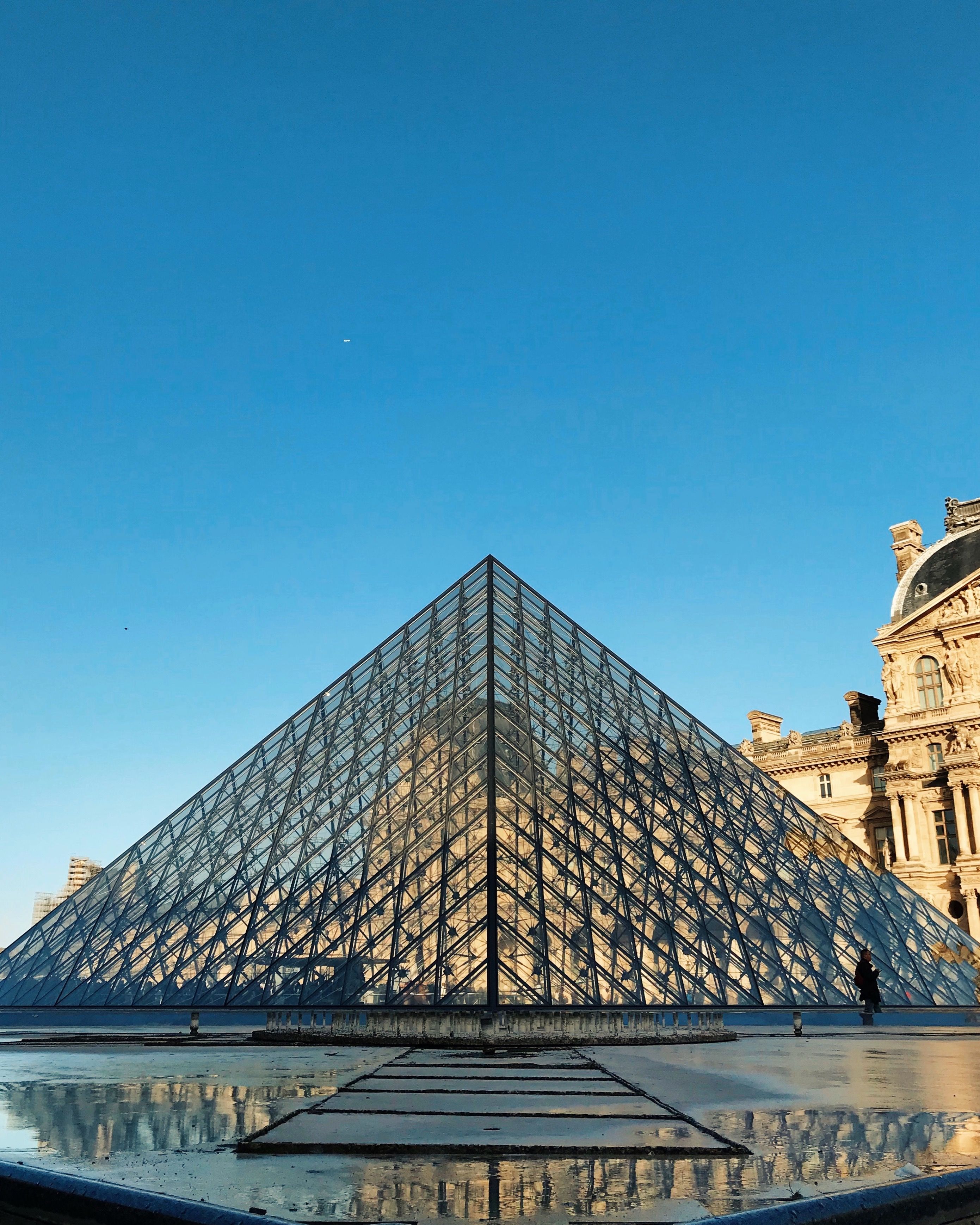 Glass Pyramid Outside of a Museum Building · Free Stock Photo