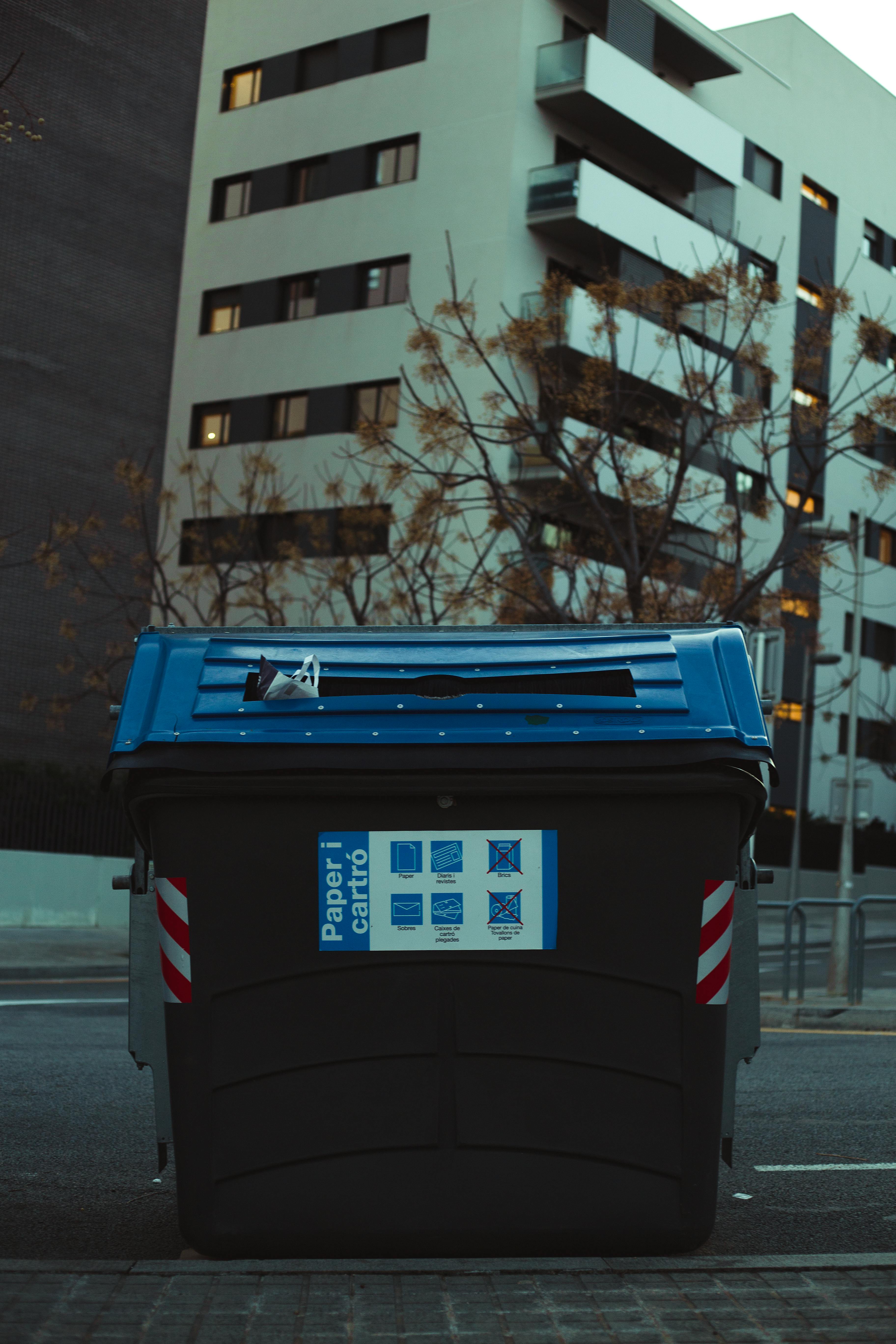 A Close-Up Shot of a Black Trash Can · Free Stock Photo